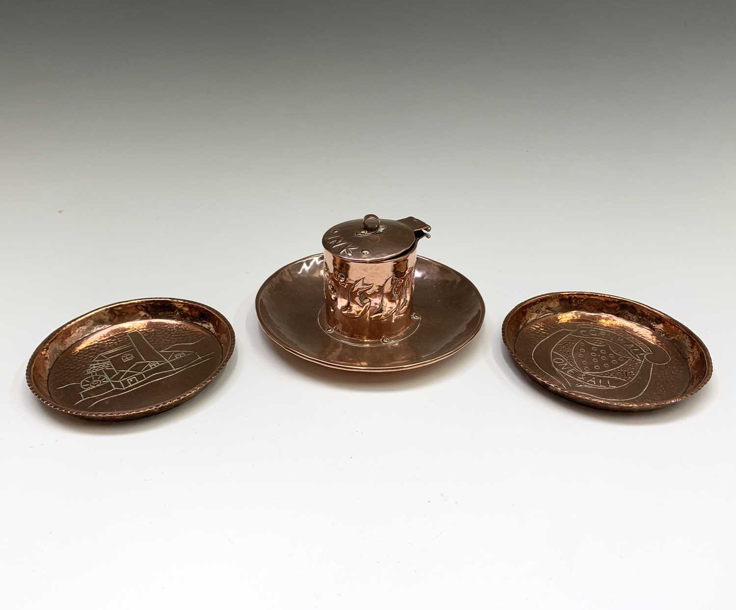 Lot 320 - An Arts and Crafts copper inkwell, with