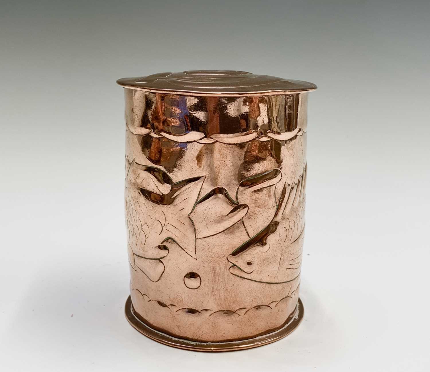 Lot 322 - A Newlyn copper cylindrical tea caddy, the