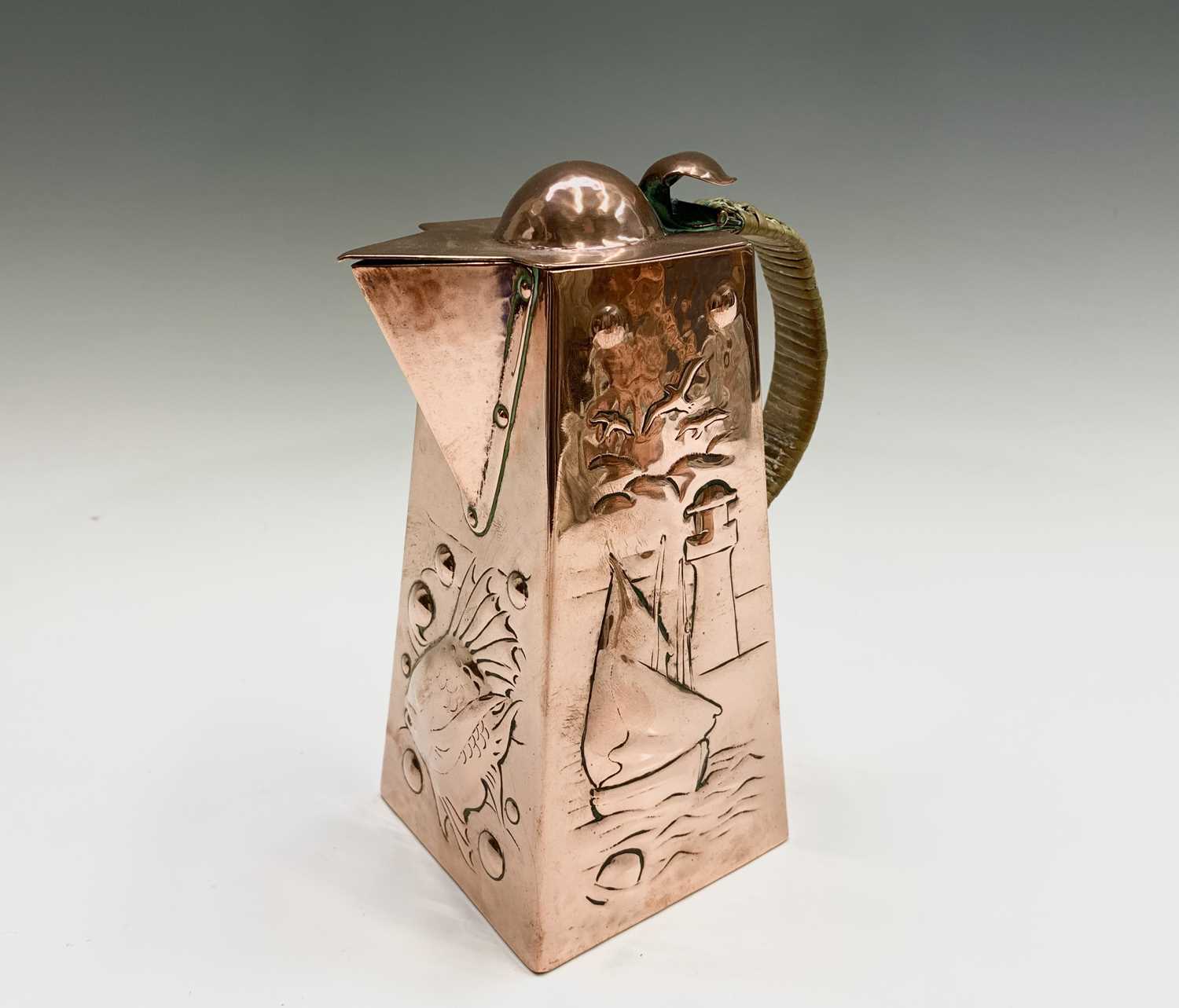 Lot 323 - A Newlyn copper coffee pot, with rattan