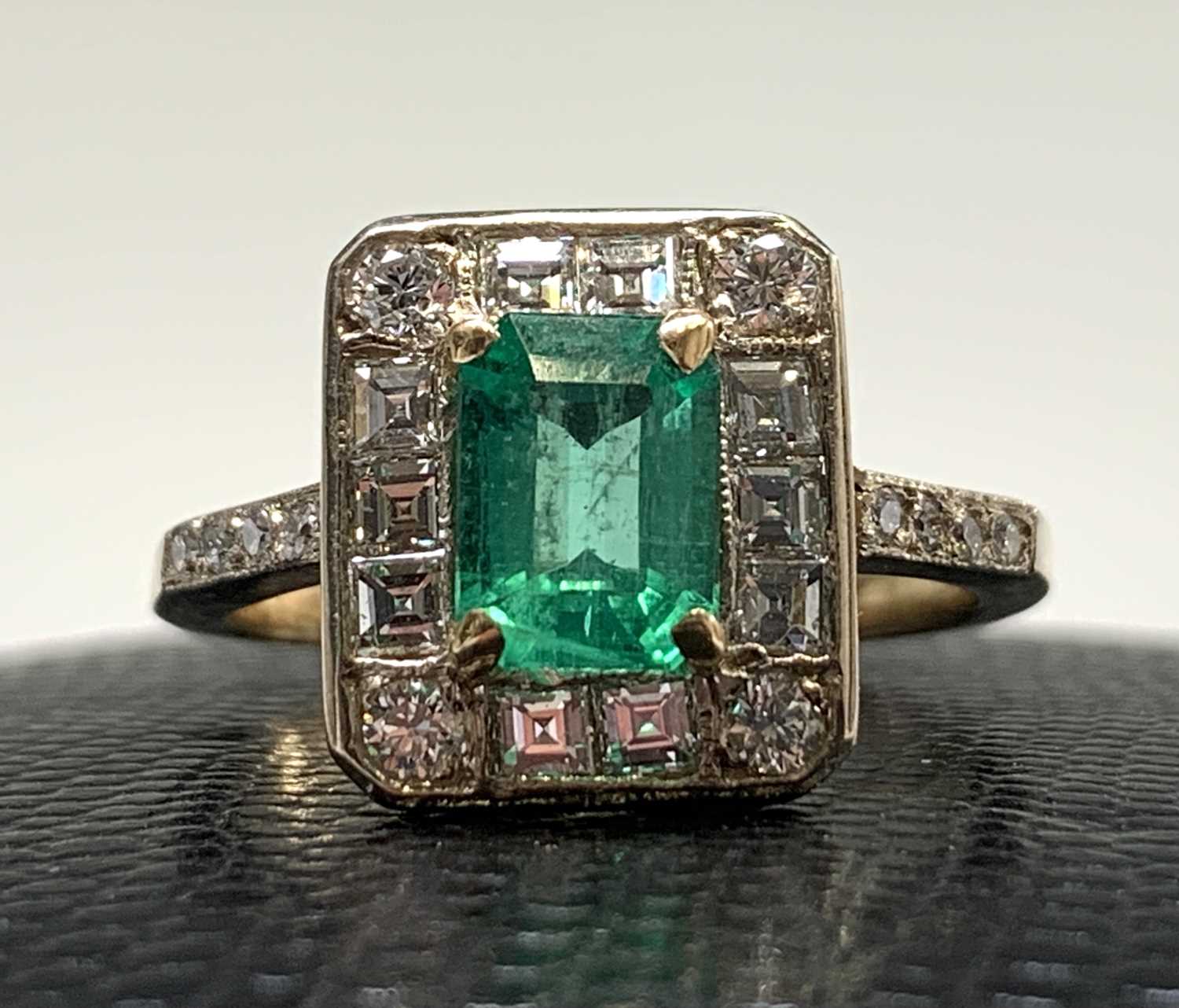 Lot 112 - An emerald and diamond ring the principal