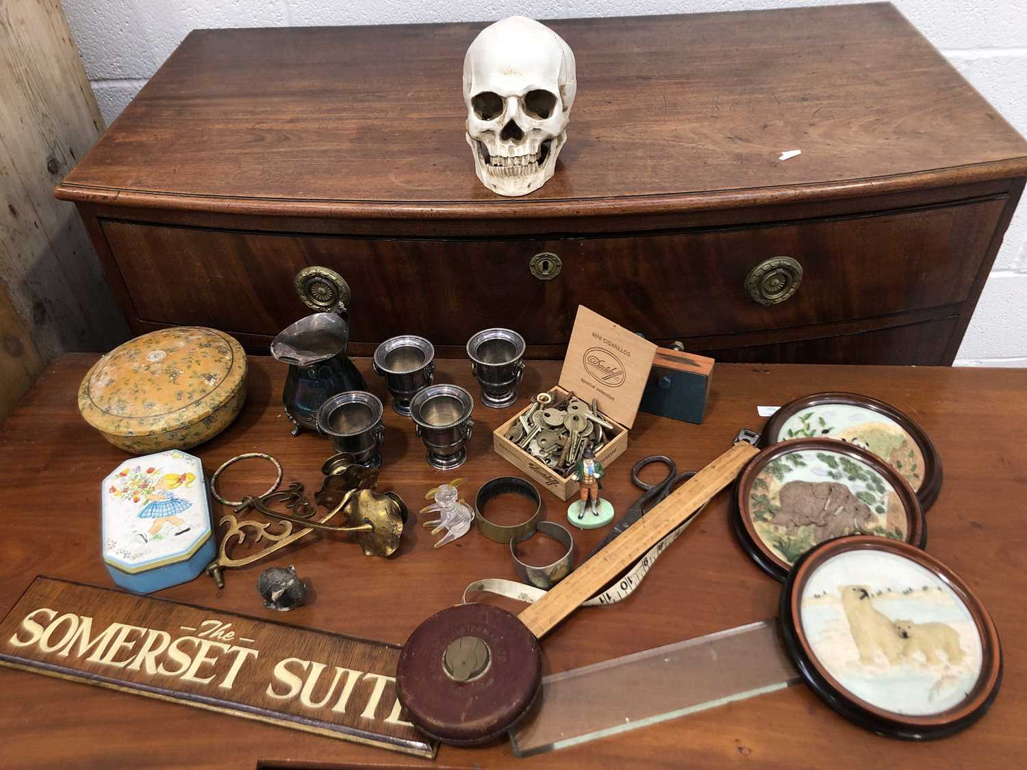 Lot 113 - Plaster skull, St Justin bracelet, Rabone