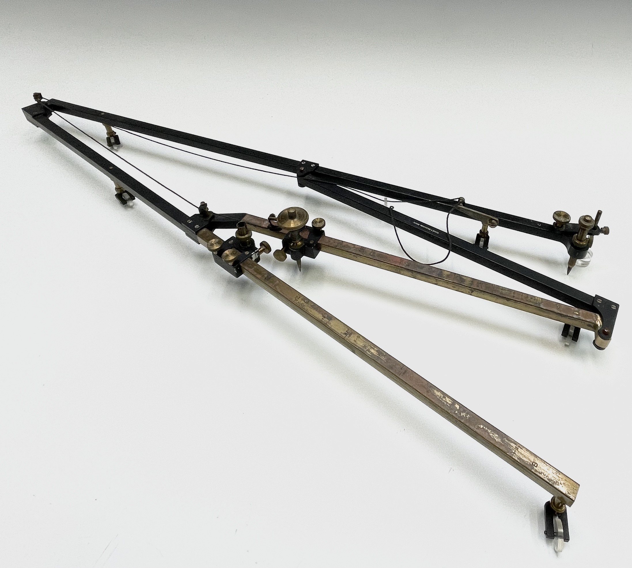 Lot 532 - A brass and black lacquered pantograph, by