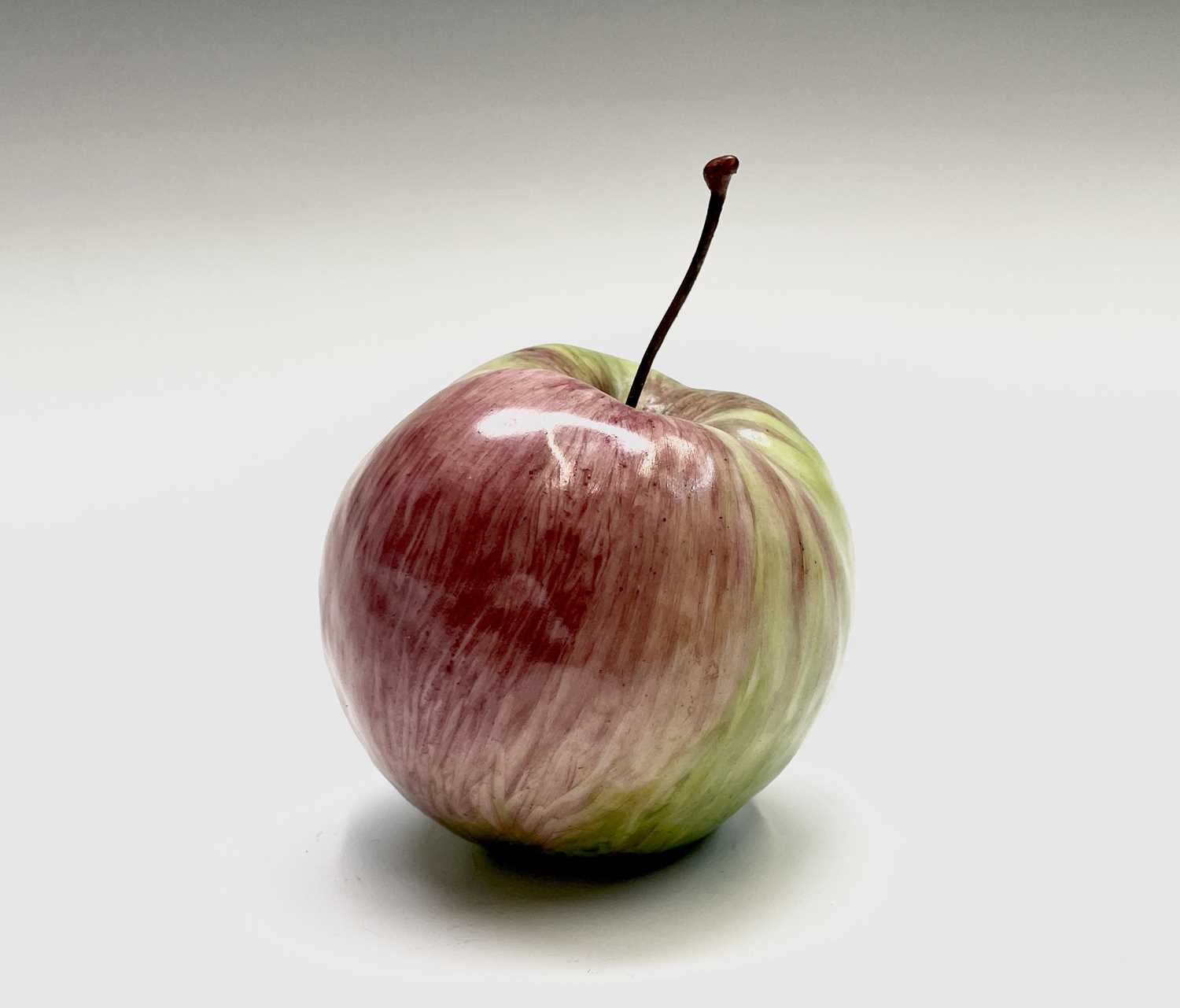 Lot 956 - A porcelain sculpture of an apple modelled