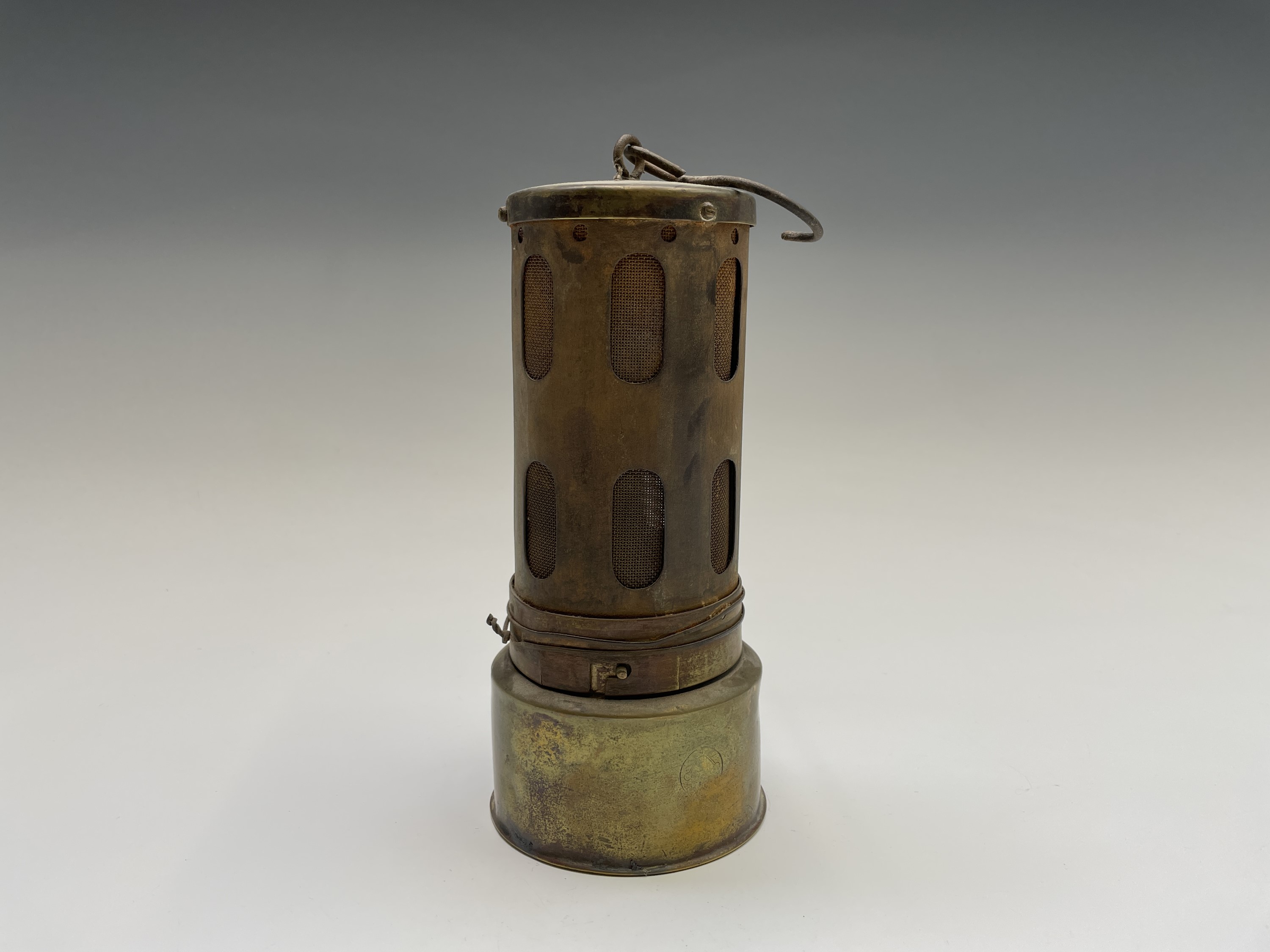 Lot 299 - A small brass and steel miners lamp, with