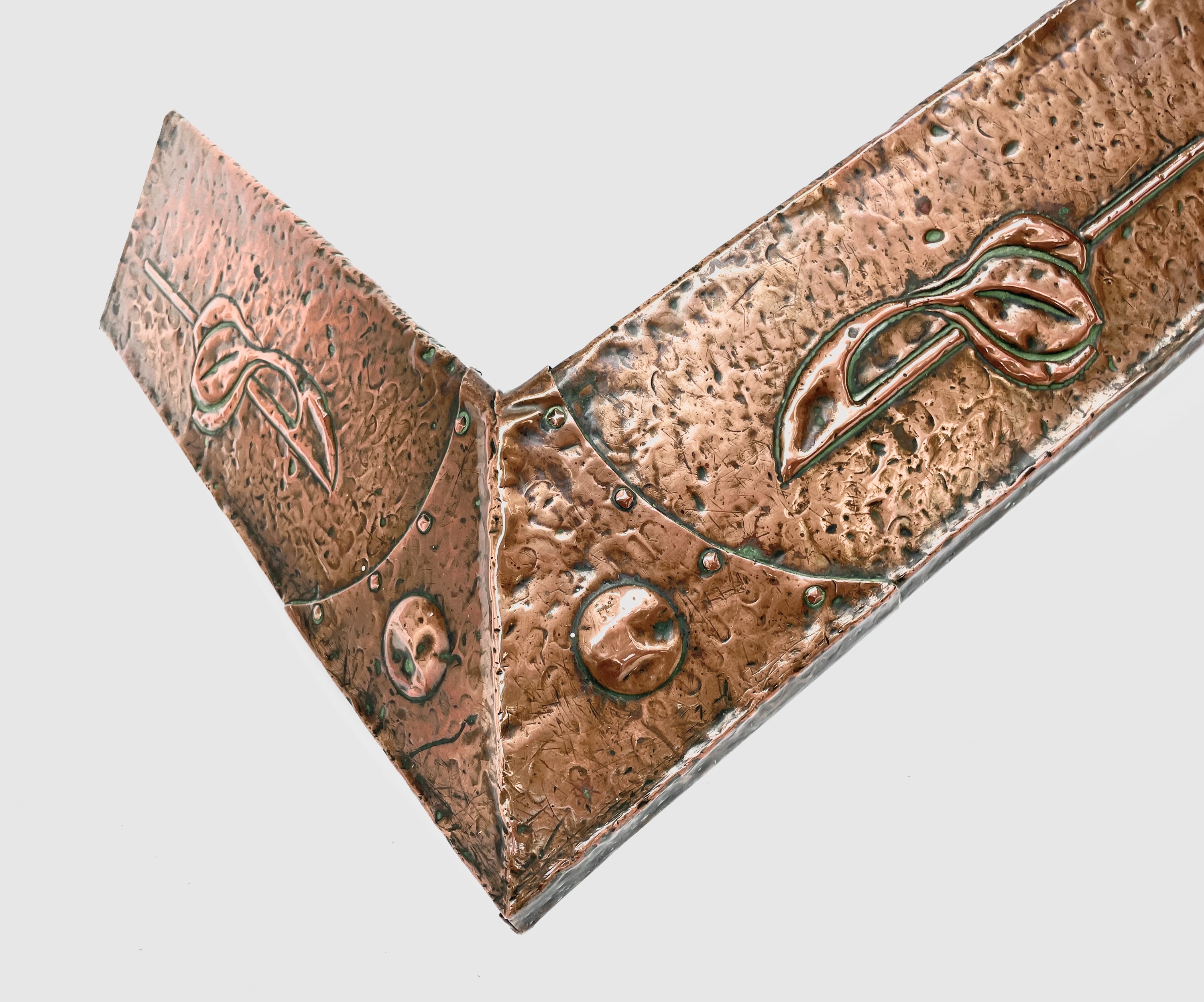 Lot 120 - An Arts and Crafts copper fender, embossed