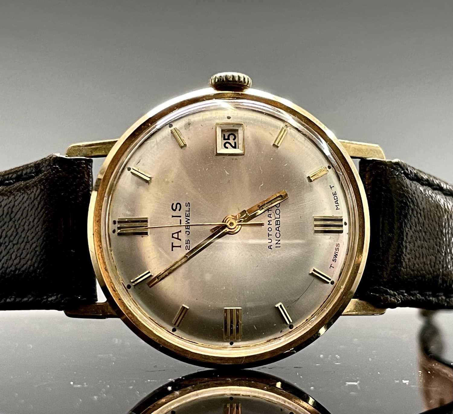 Lot 215 - A gentleman's 9ct gold wristwatch by Talis