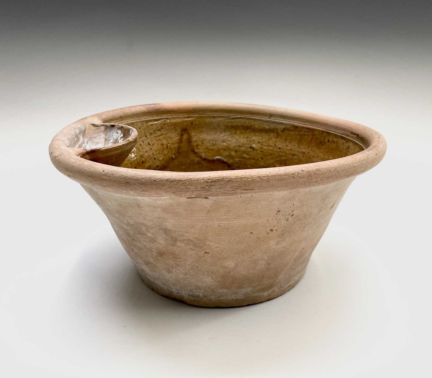 Lot 529 - A terracotta farming pan, with glazed
