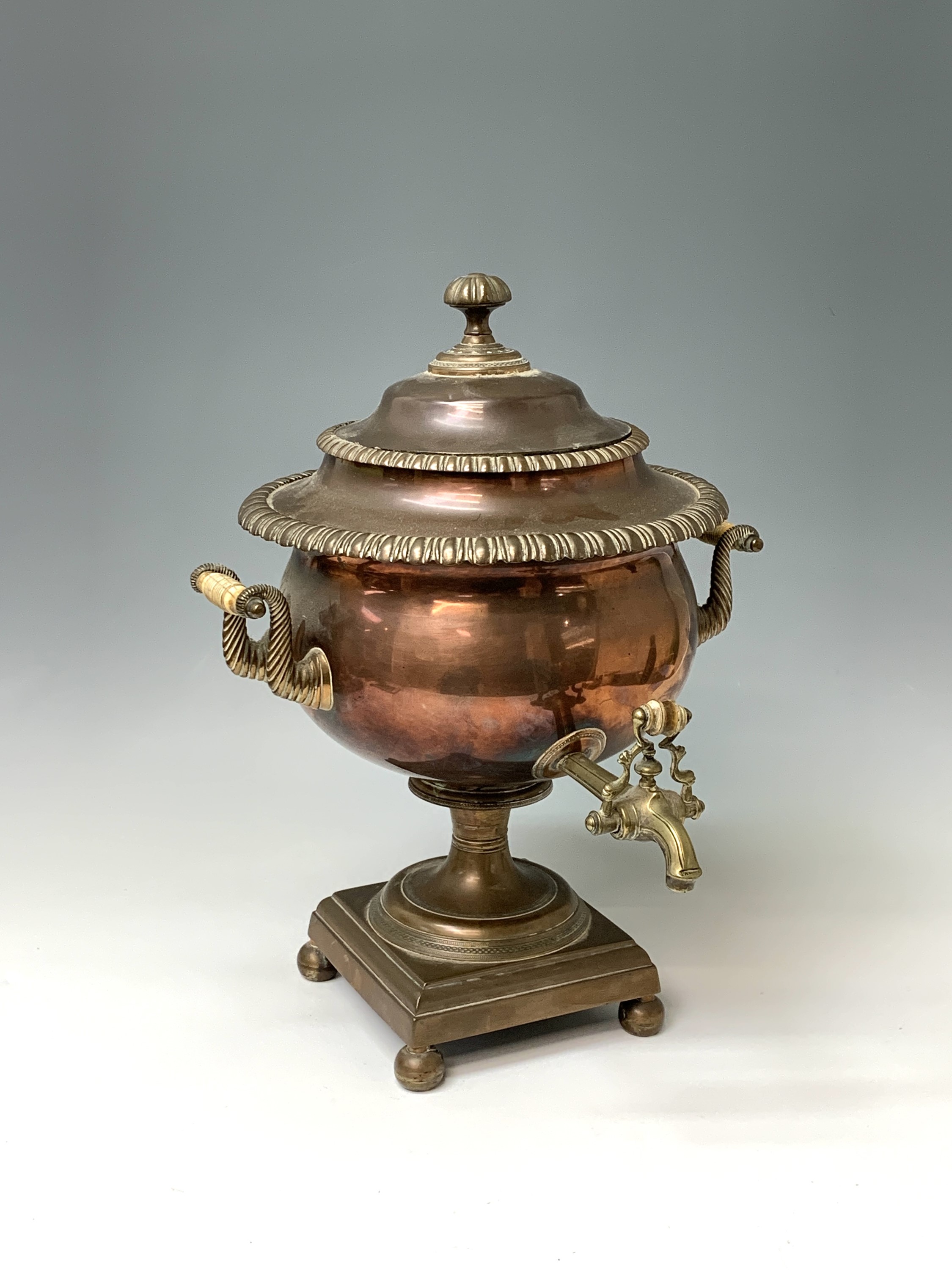 Lot 358 - A Regency copper tea urn, with brass tap,