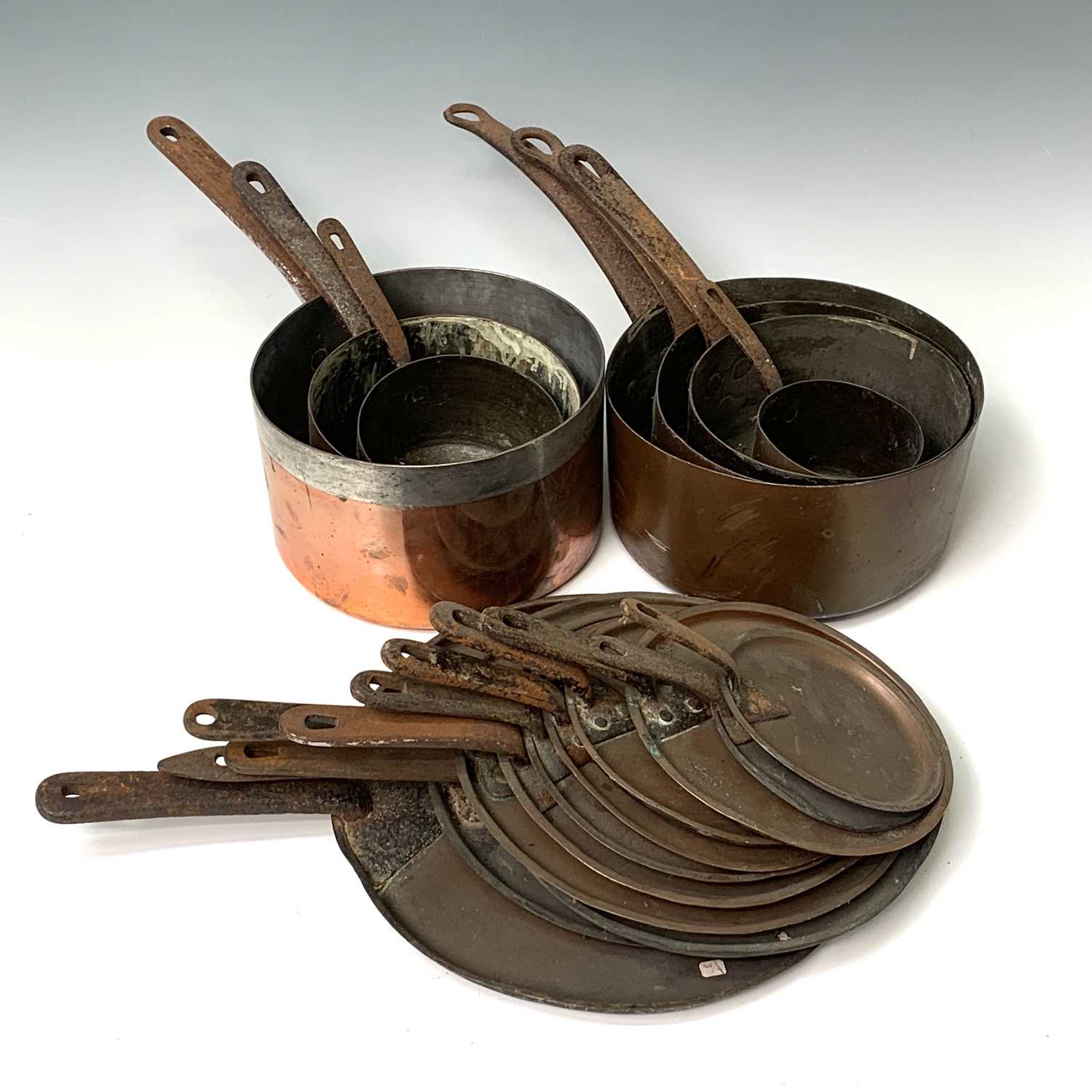 Lot 441 - Seven Victorian copper pans, each with iron