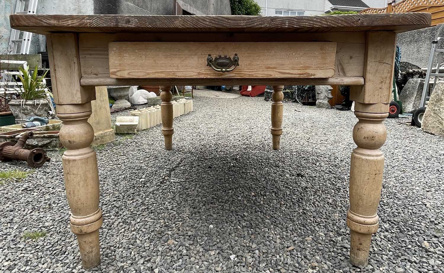 Lot 480 - A pine kitchen table, circa 1900, the