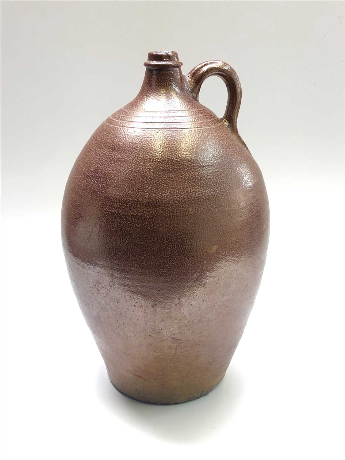 Lot 1025 - A large German stoneware storage flagon,