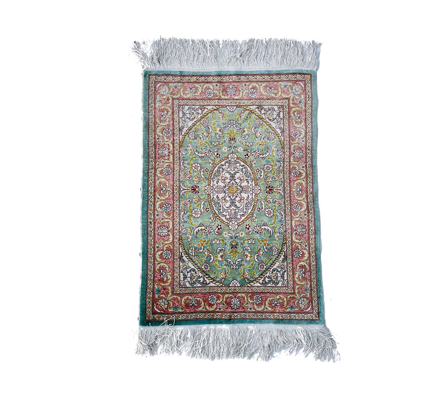 Lot 1200 - A Turkish silk rug, the pale blue field