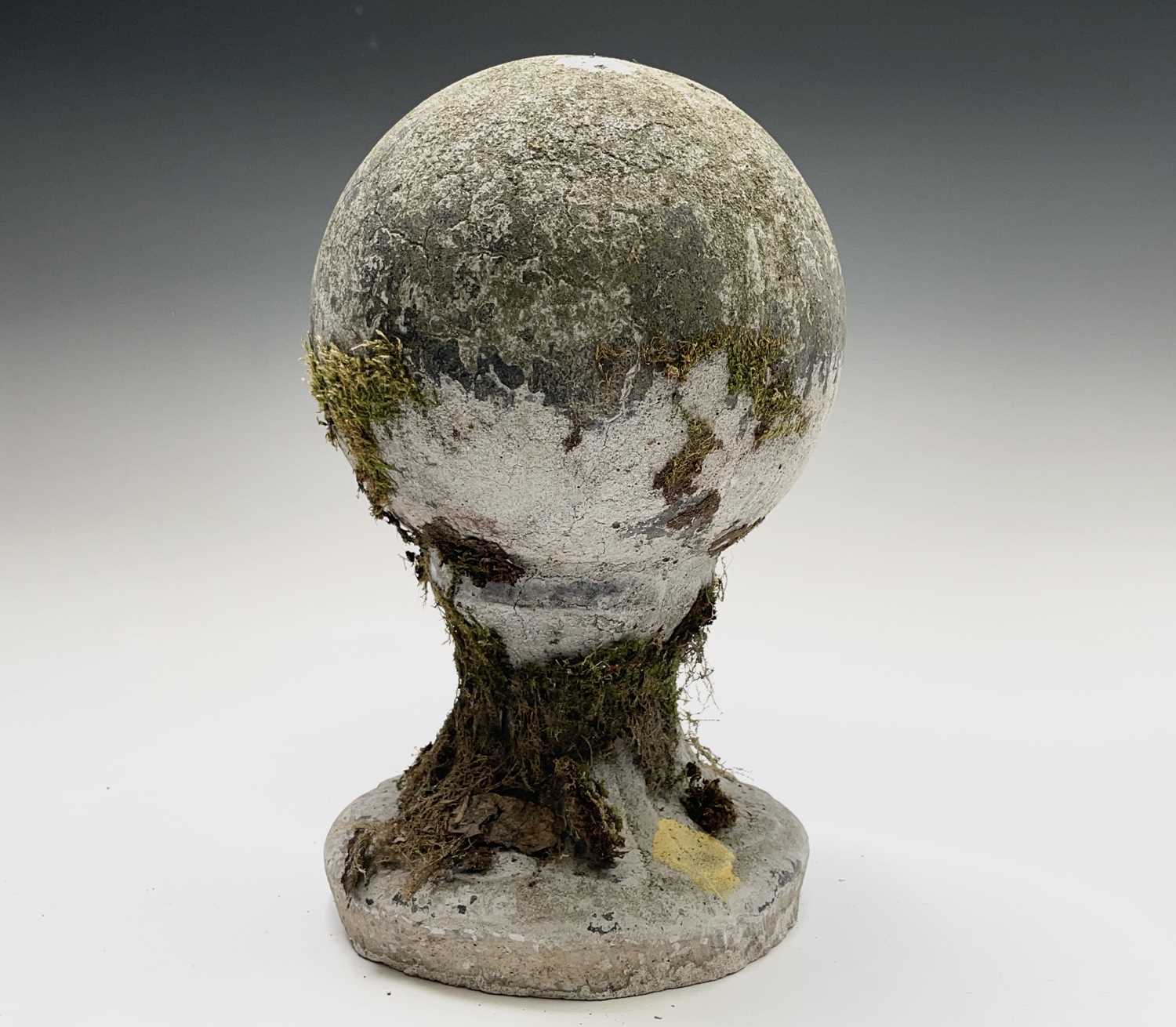 Lot 617 - A composition stone gate post ball finial.