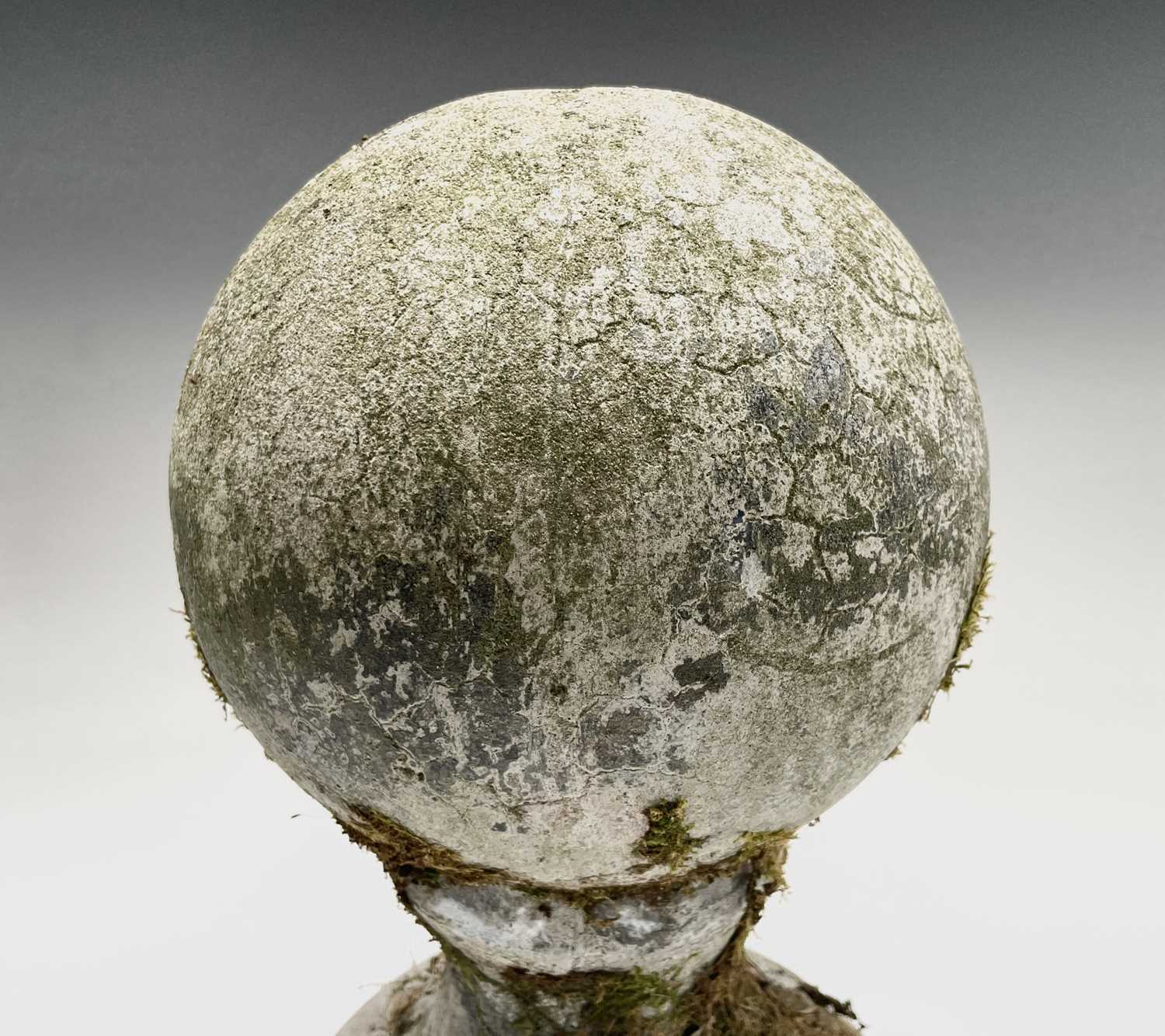 Lot 617 - A composition stone gate post ball finial.