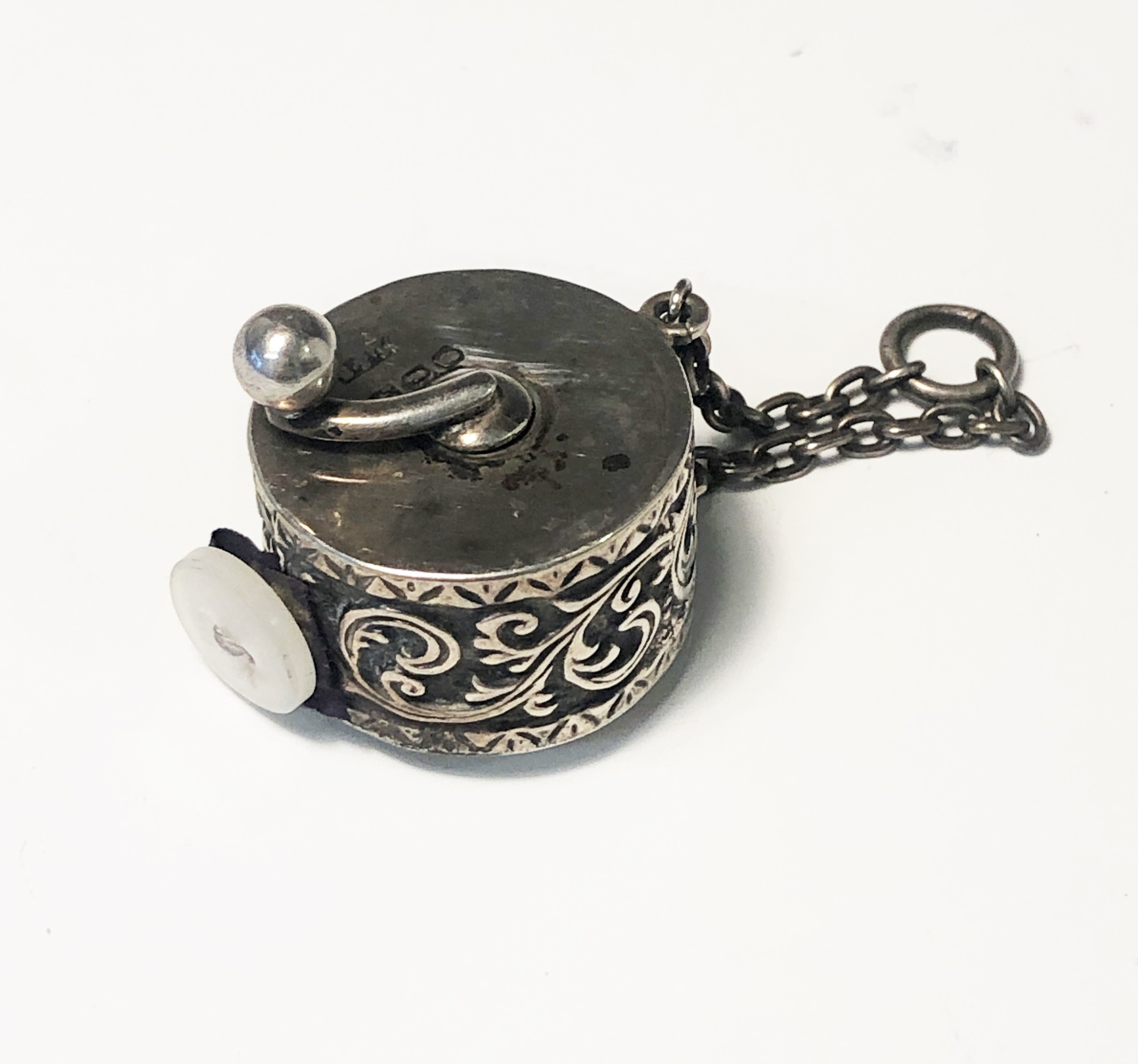 Lot 2013 - A silver cased tape measure