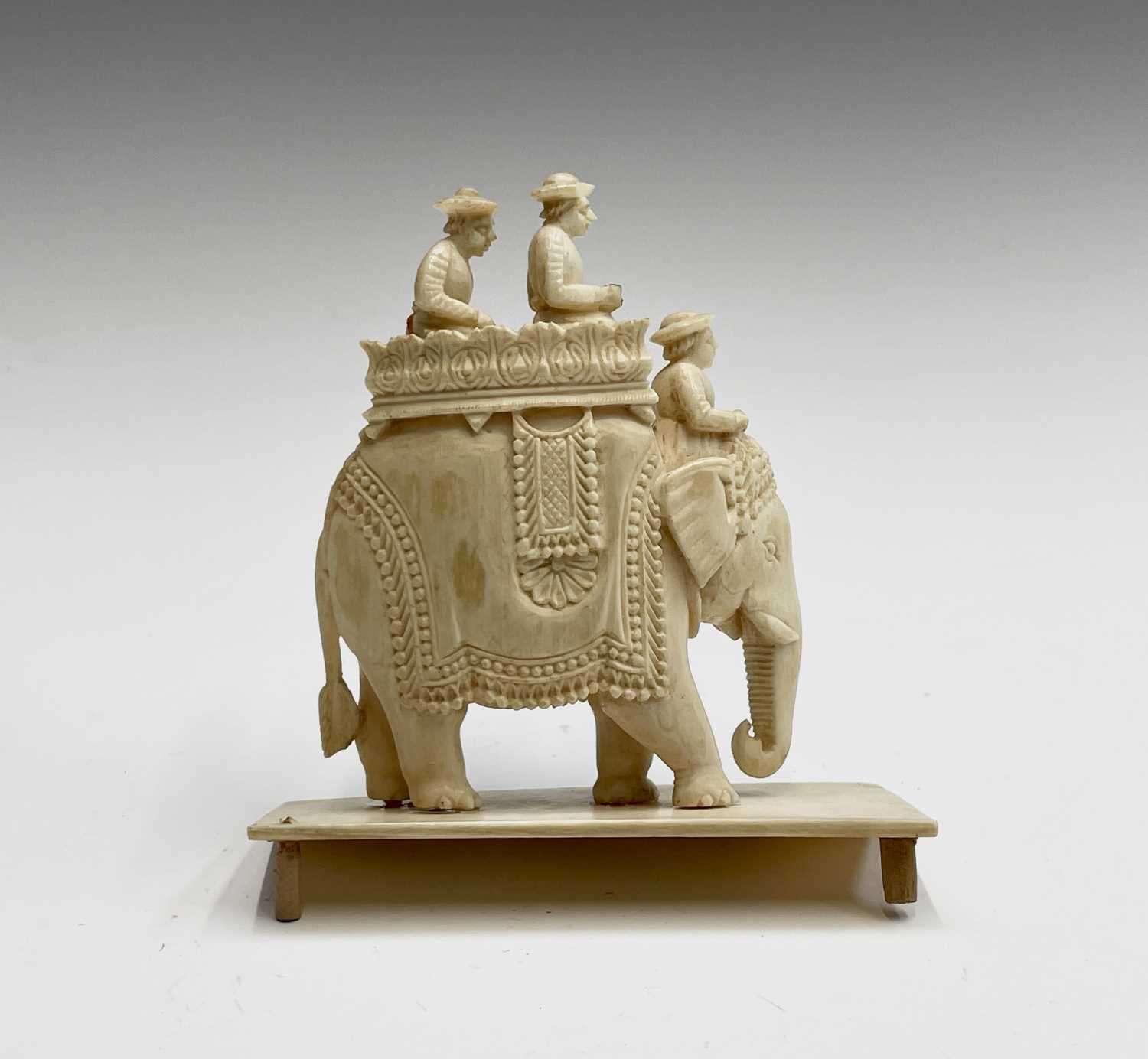 Lot 1057 - An Indian carved ivory model of an elephant,