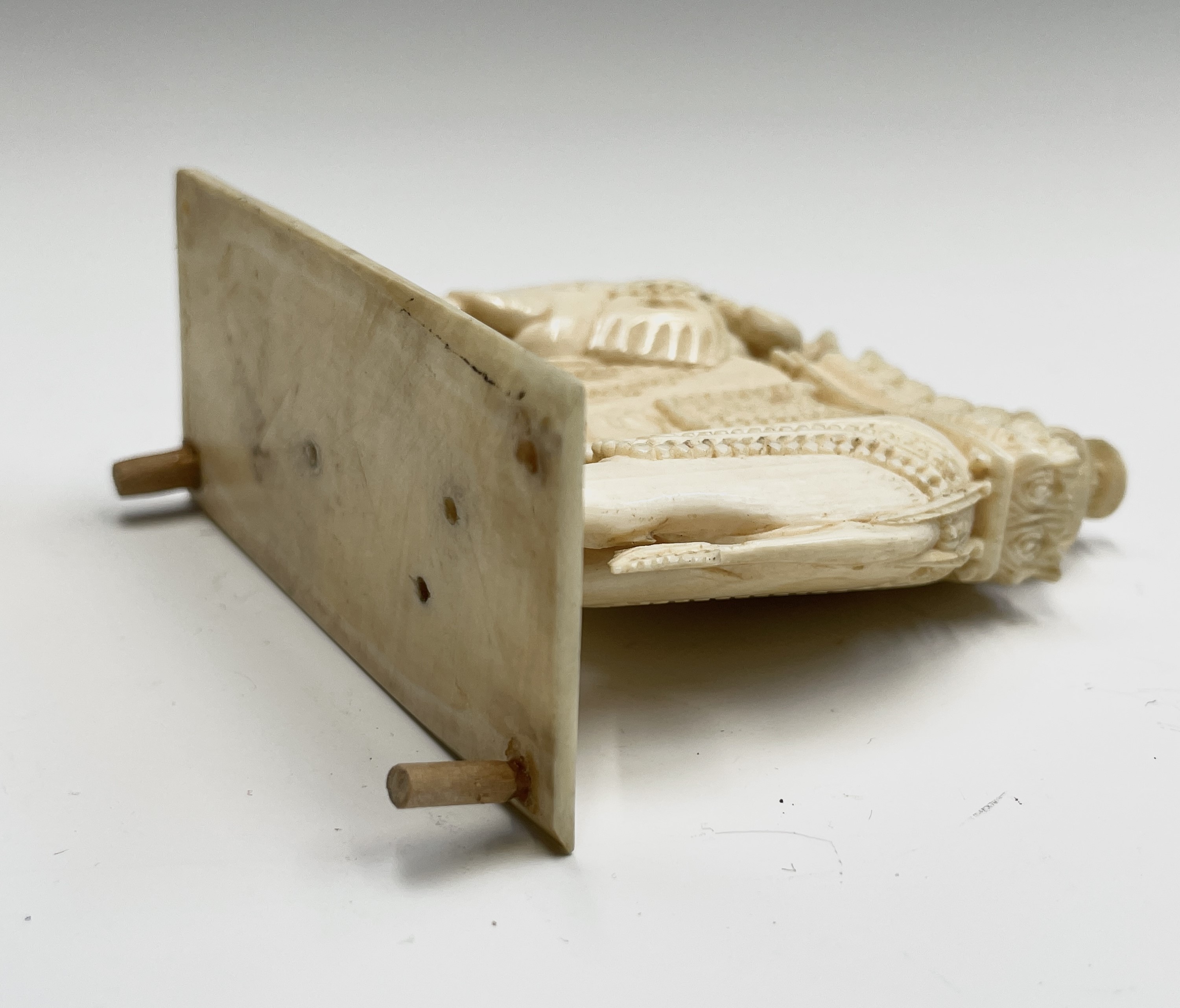 Lot 1057 - An Indian carved ivory model of an elephant,