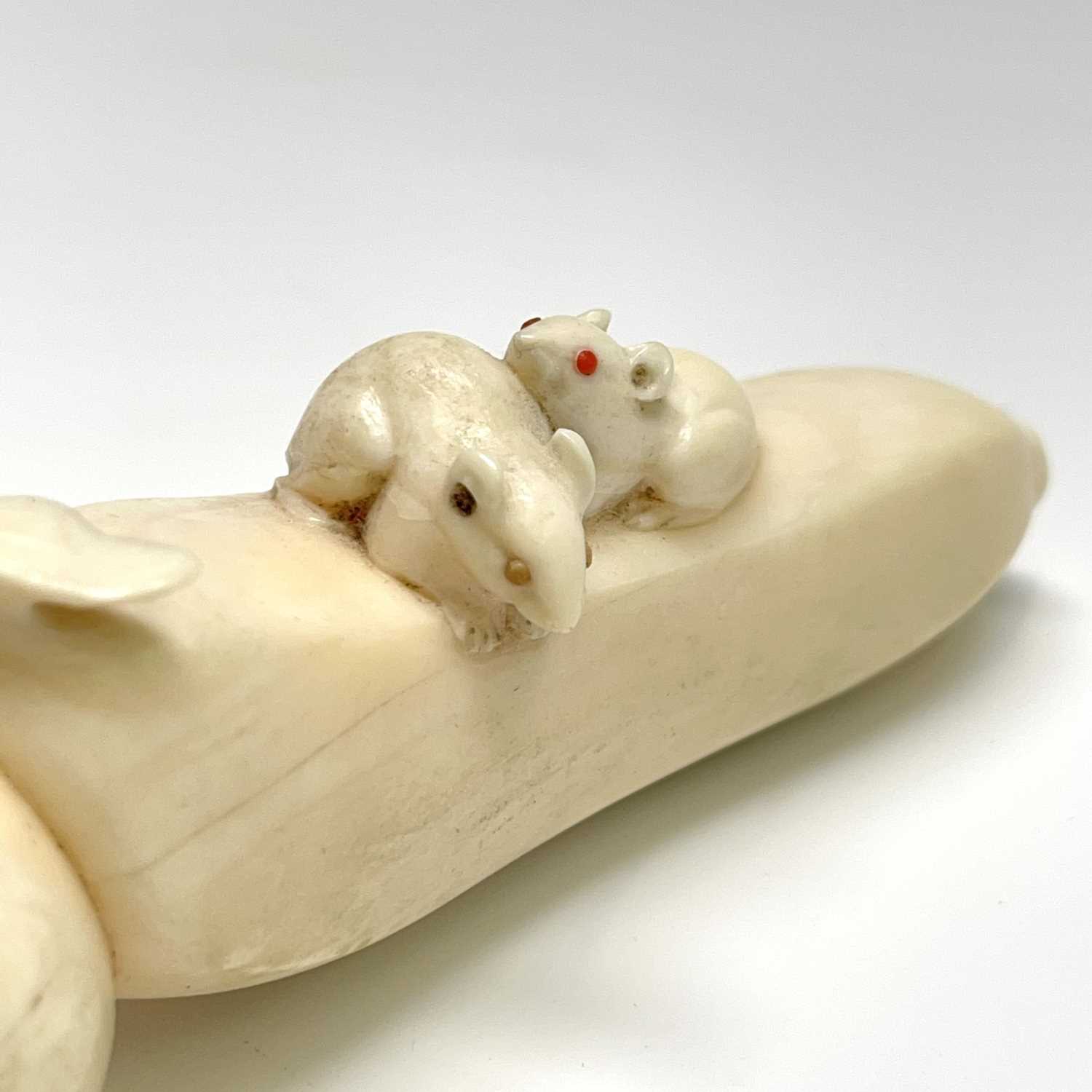 Lot 310 - A Japanese ivory carving of mice and fruit,