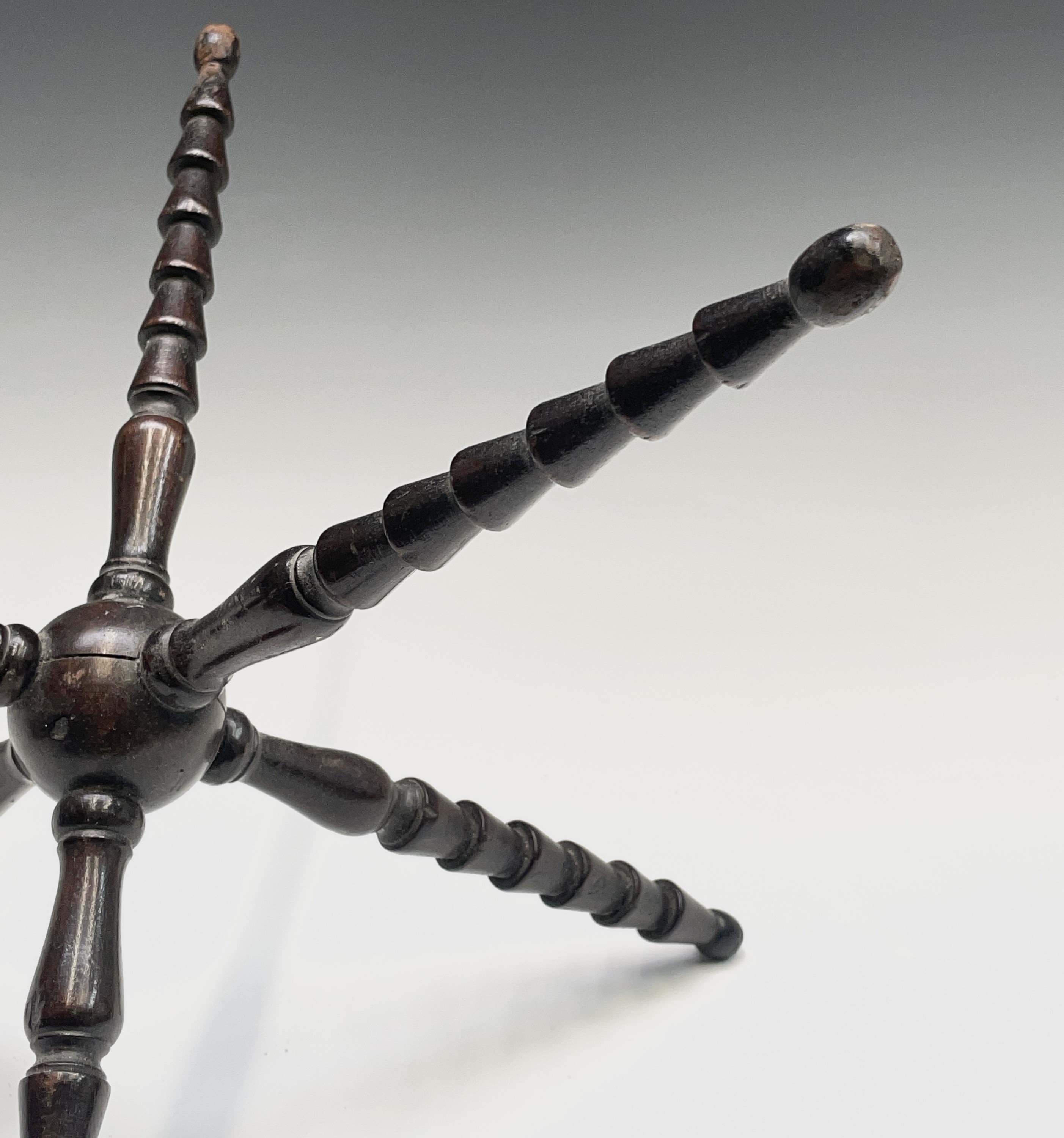Lot 12 - A turned mahogany cat, 19th century, with