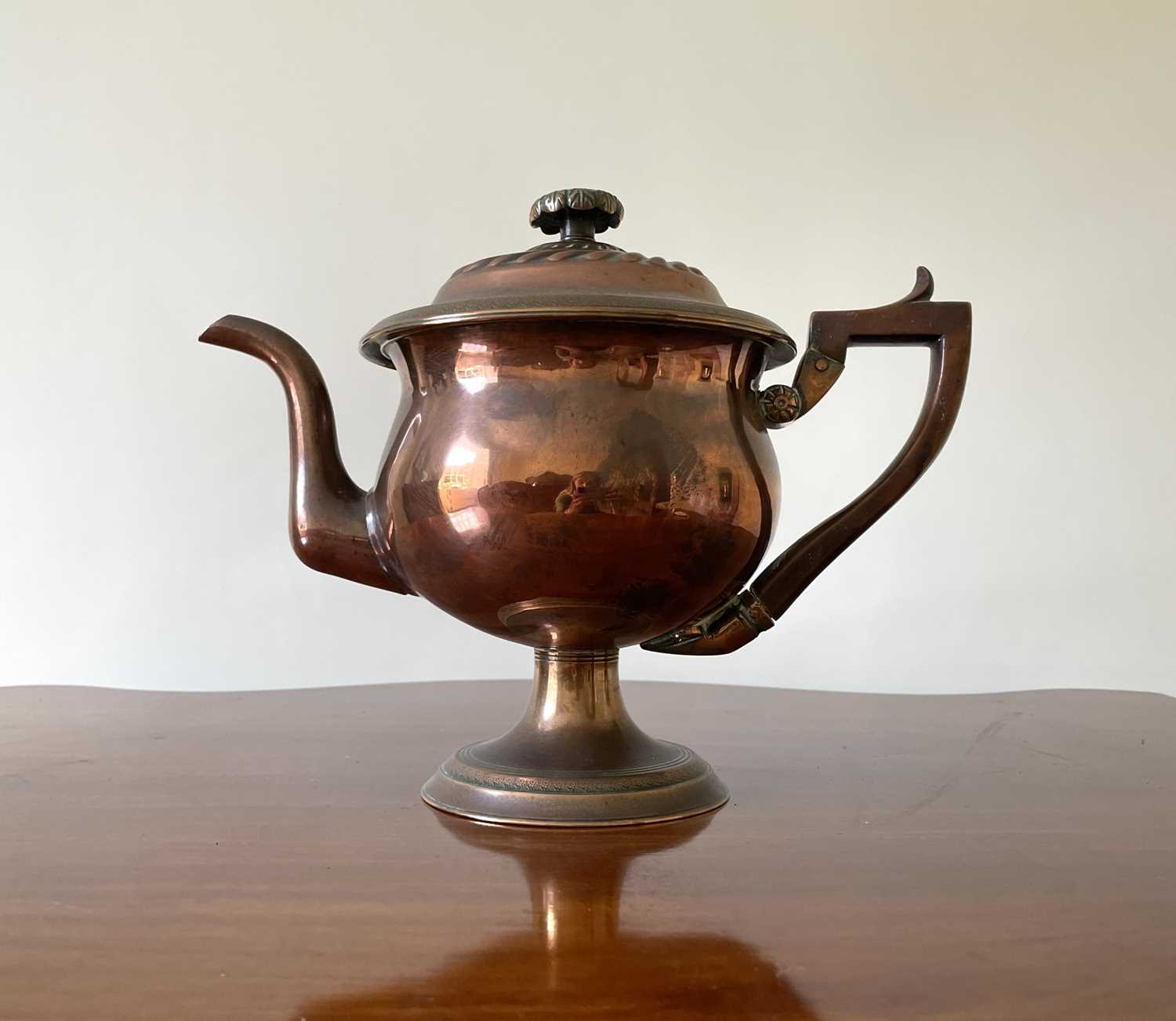 Lot 344 - A William IV copper teapot, with
