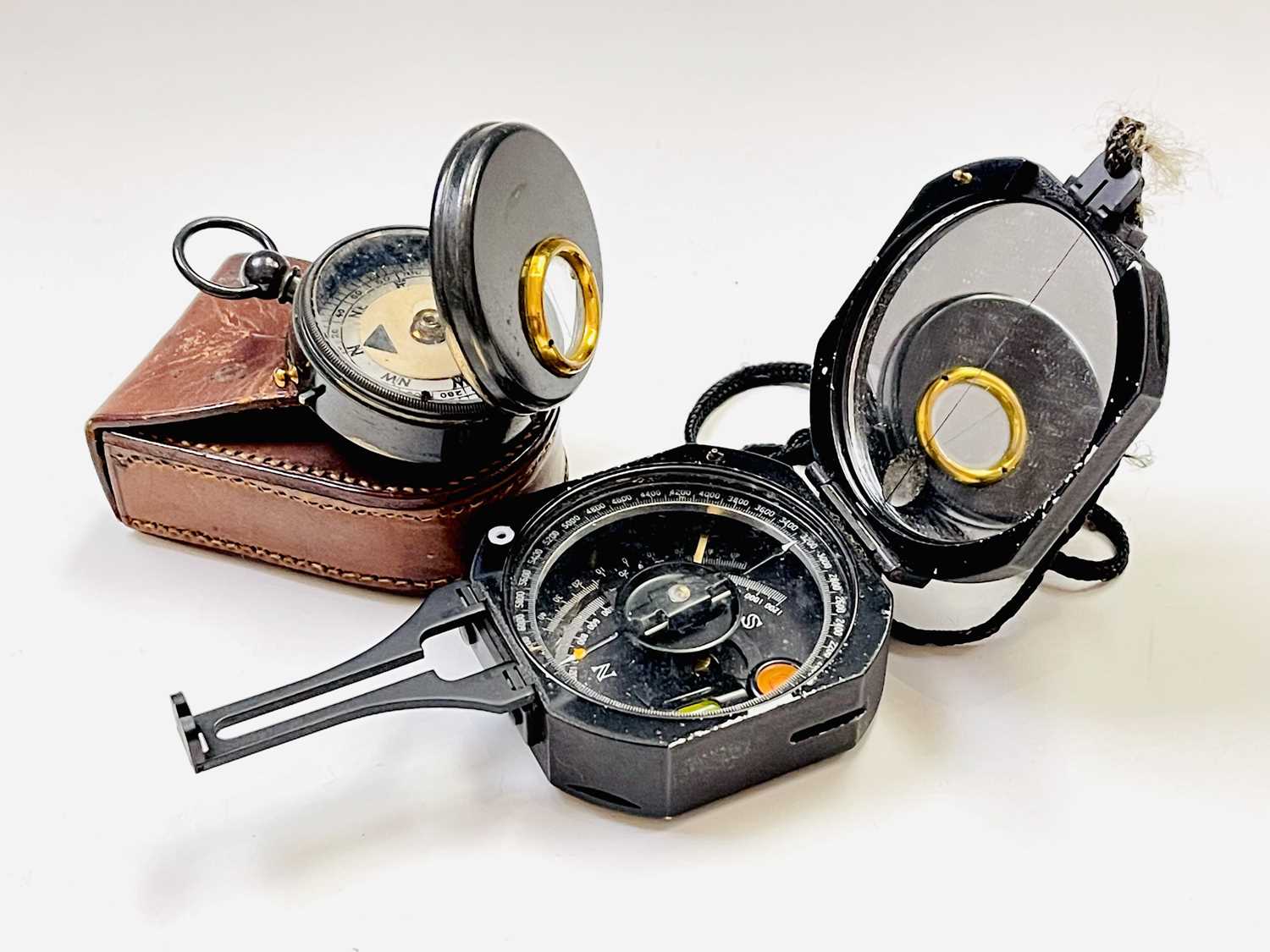 Lot 411 - A lacquered brass military handheld compass,