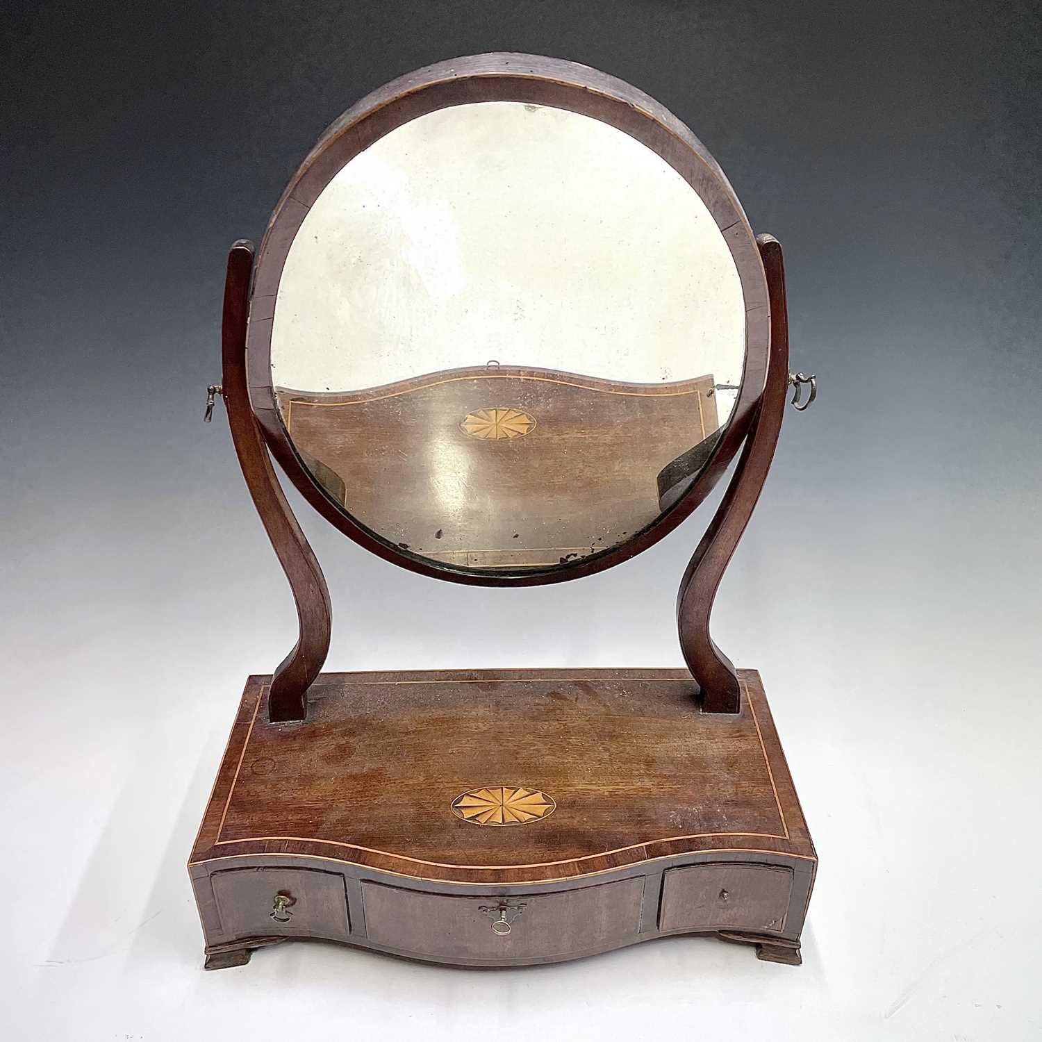 Lot 3130 - A George III mahogany oval dressing table