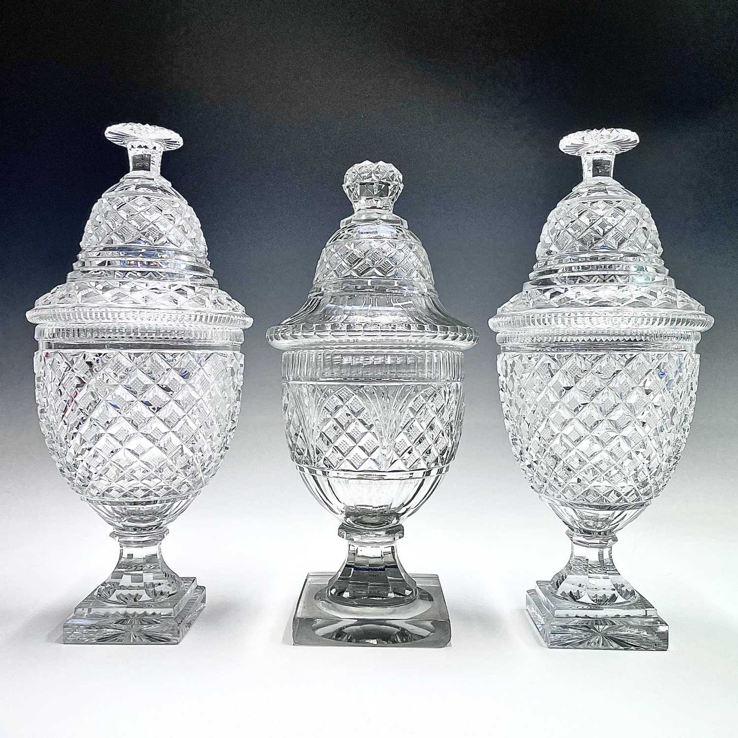 Lot 919 - A pair of cut glass sweet meat jars and