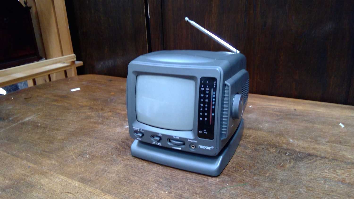 Lot 224 - A MAXIM MINI Portable battery powered TV and