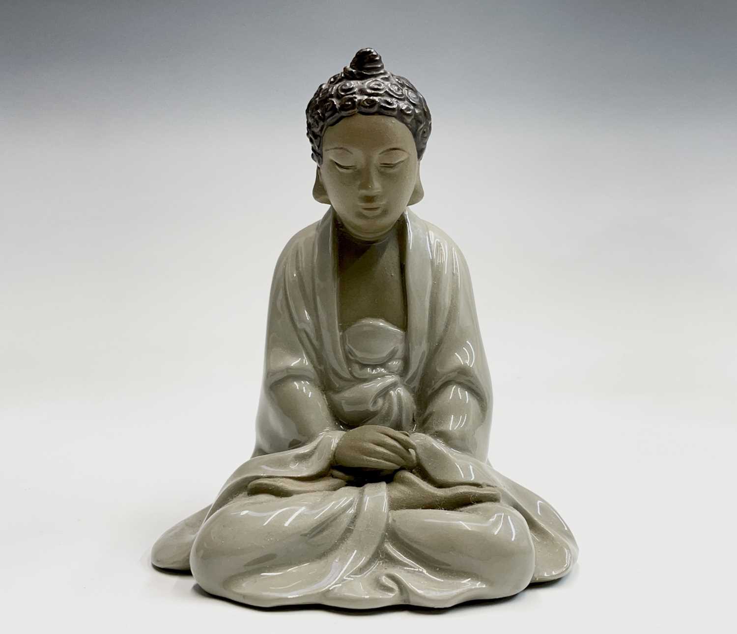Lot 208 - A Chinese Shiwan porcelain figure of a