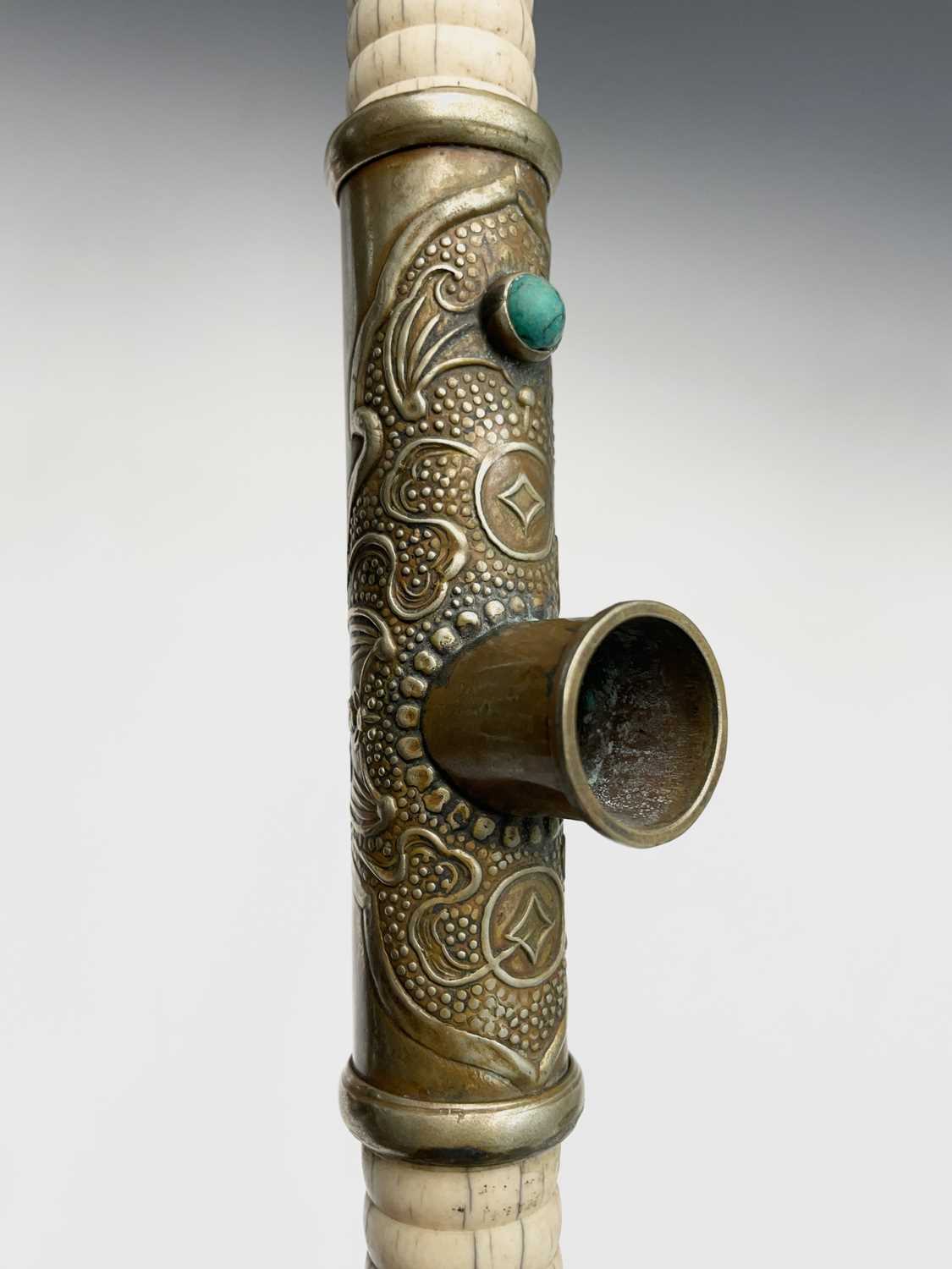 Lot 241 - A Chinese curved bone opium pipe, late