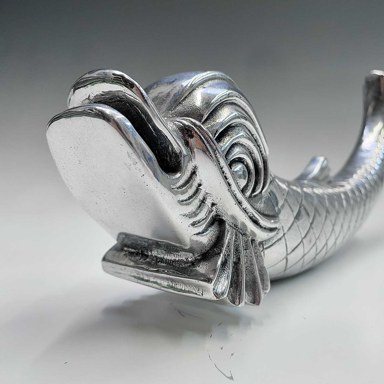 Lot 399 - A chrome dolphin nautical marine fitting,