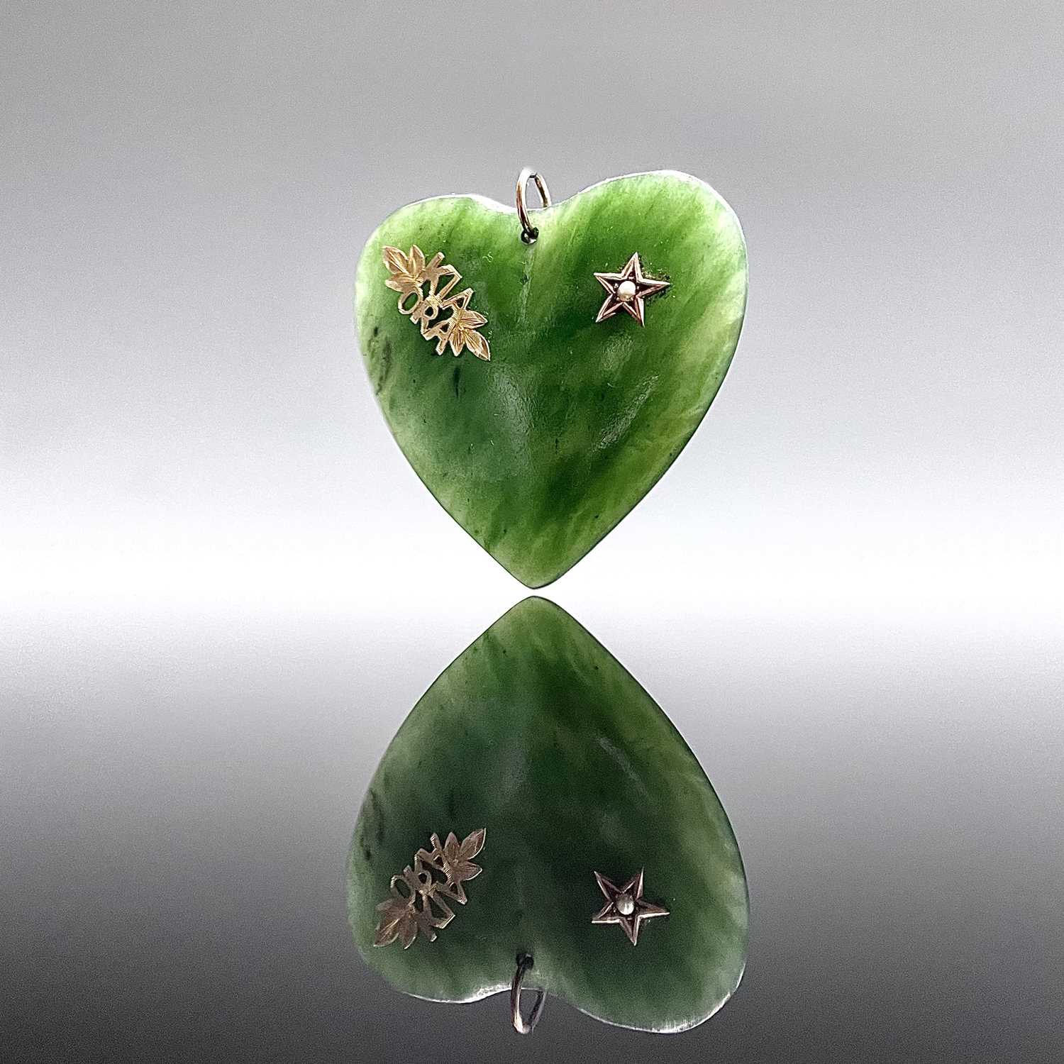 Lot 290 - A New Zealand greenstone heart pendant with