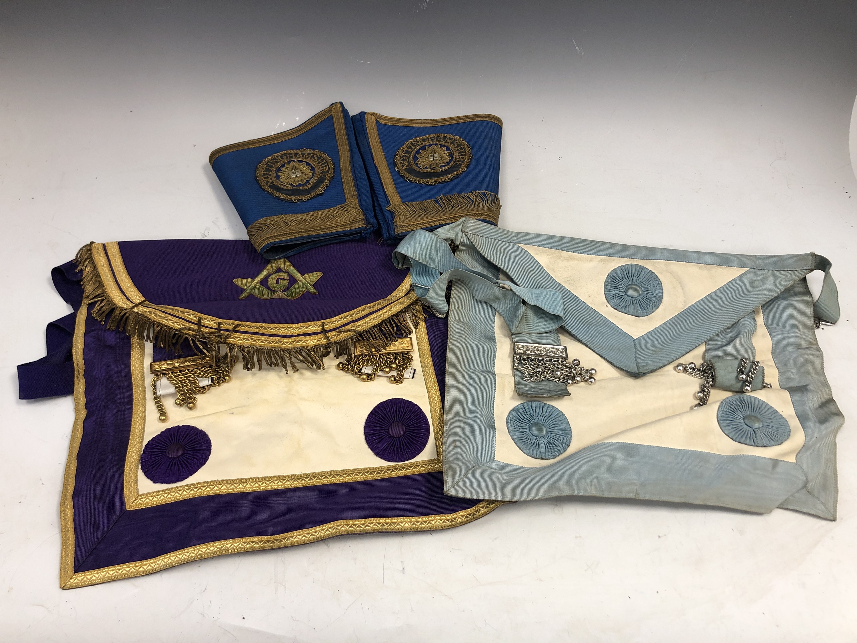 Lot 241 - Masonic regalia, including aprons and cuffs.