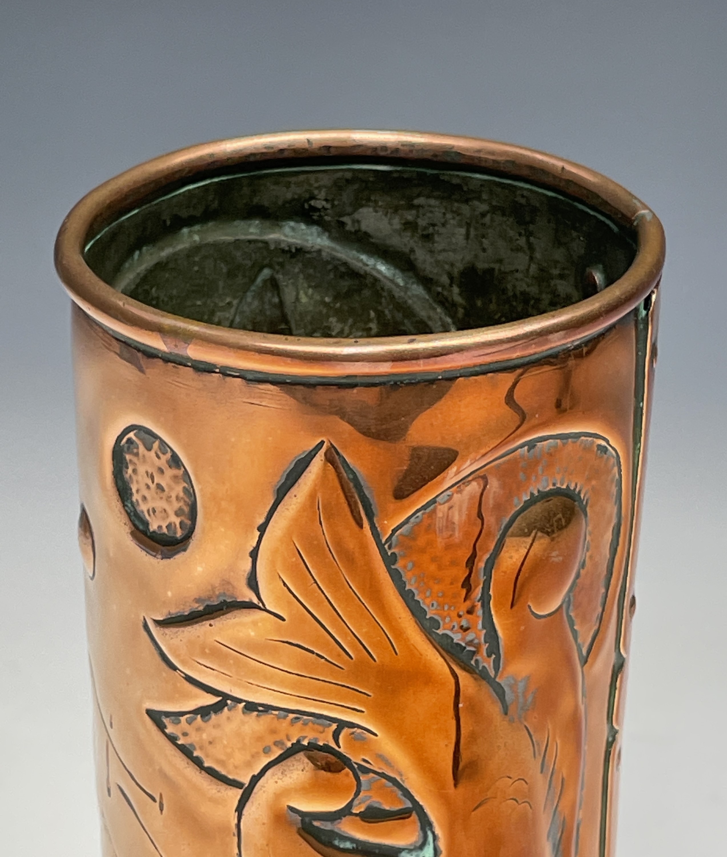 Lot 307 - A Newlyn copper cylindrical vase, repousse