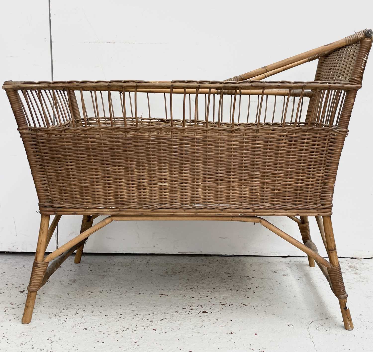 Lot 172 - A wicker cot, early 20th century, width 94cm.