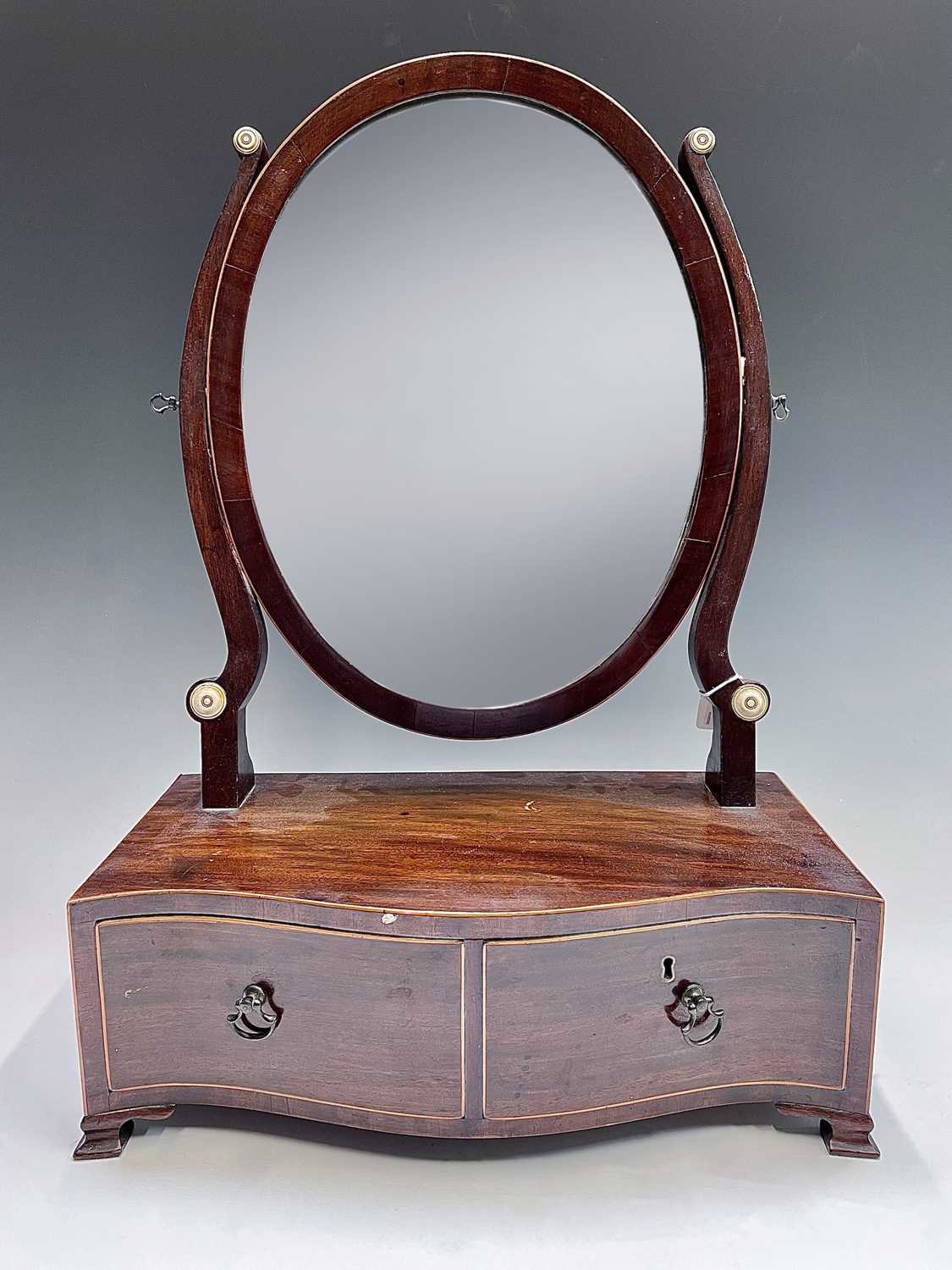 Lot 3066 - A George III mahogany oval dressing table