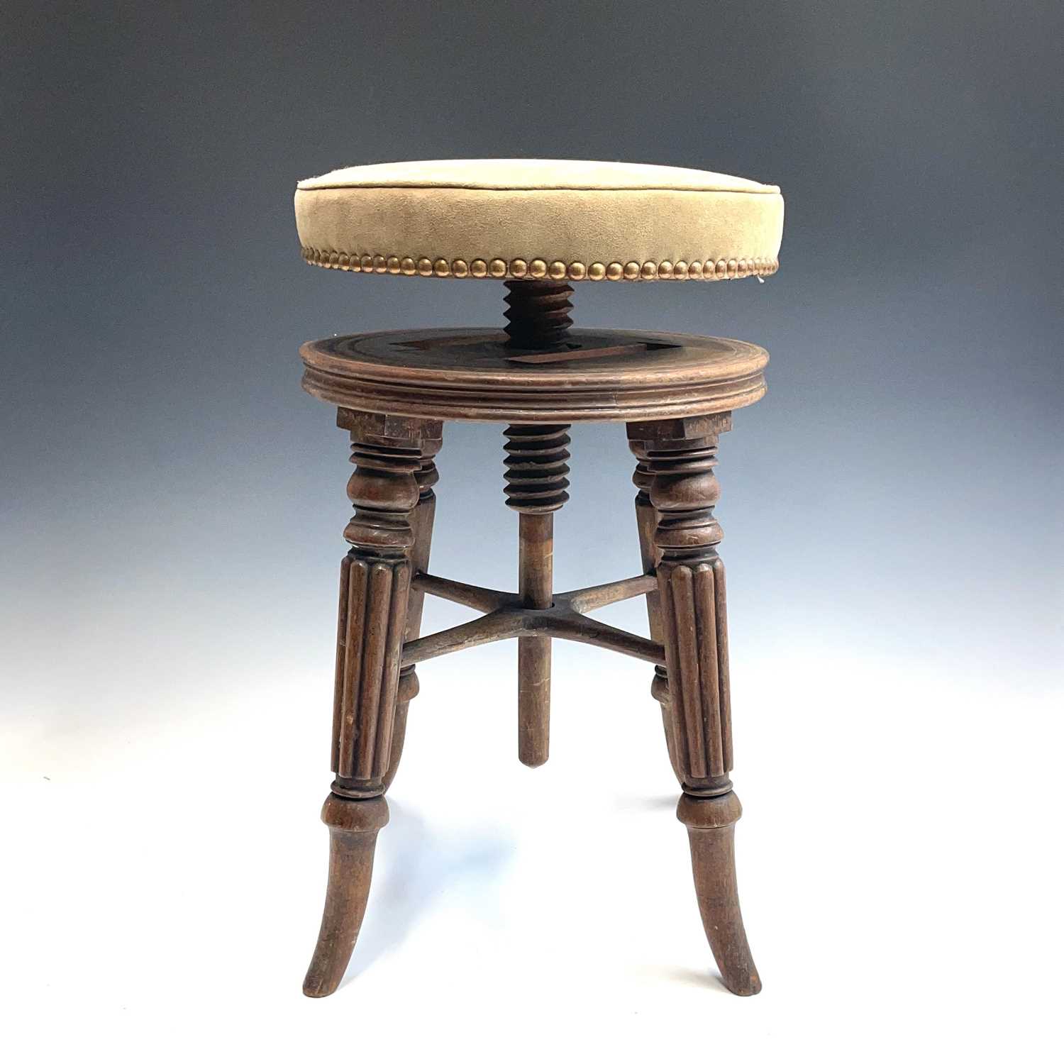 Lot 3050 - A Regency mahogany circular piano stool,