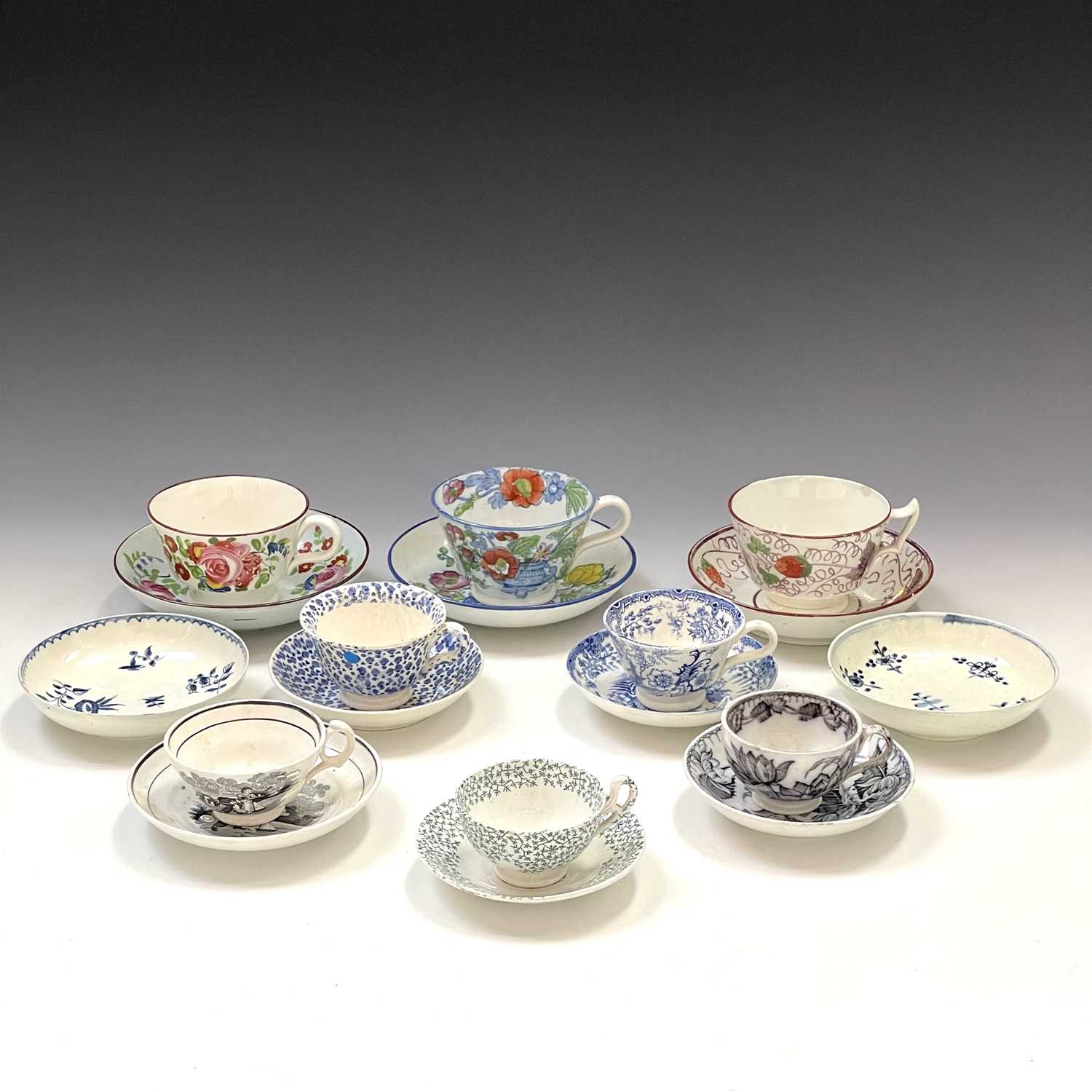 Lot 835 - A Cambrian pottery cup and saucer, over