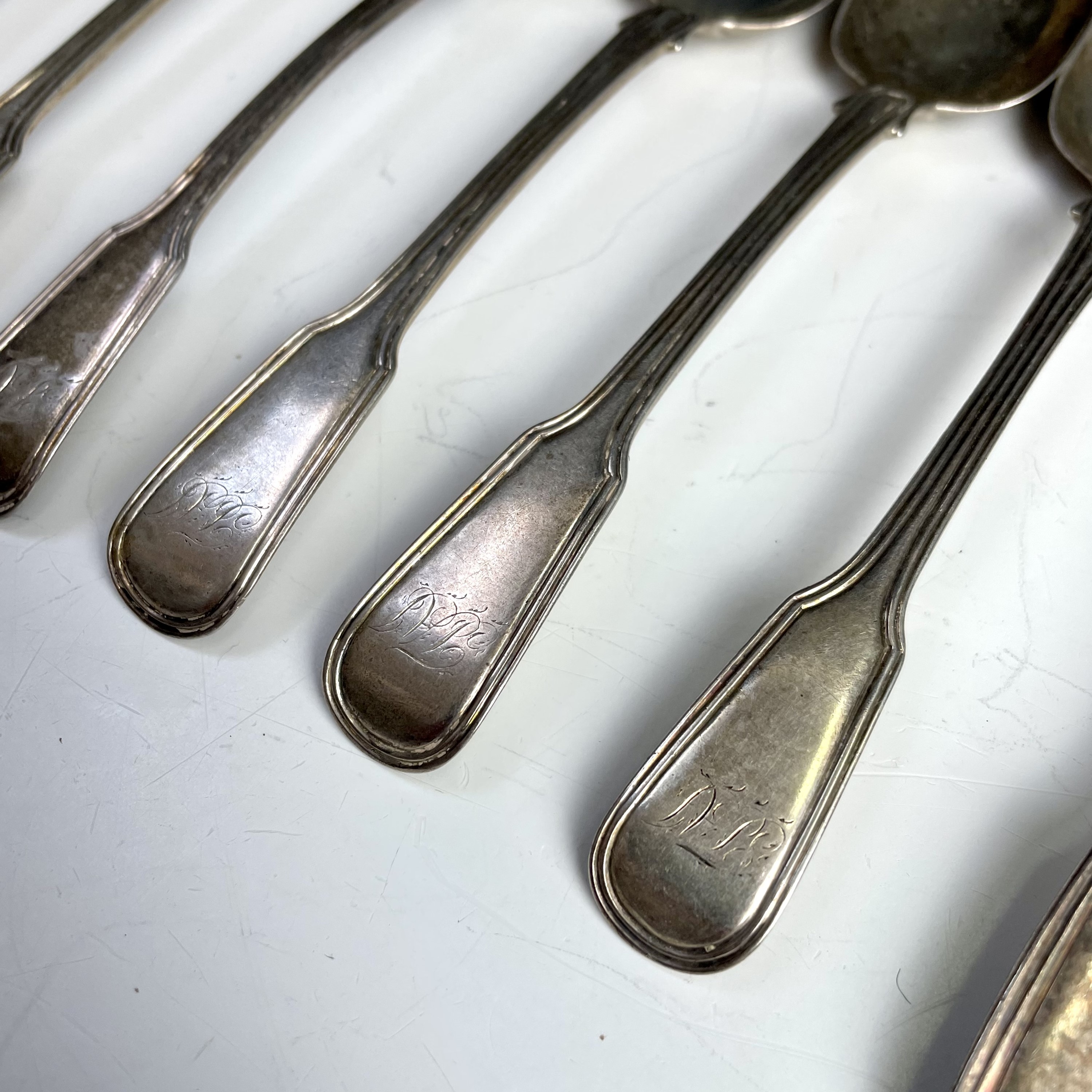 Lot 32 - A set of five George III silver fiddle and