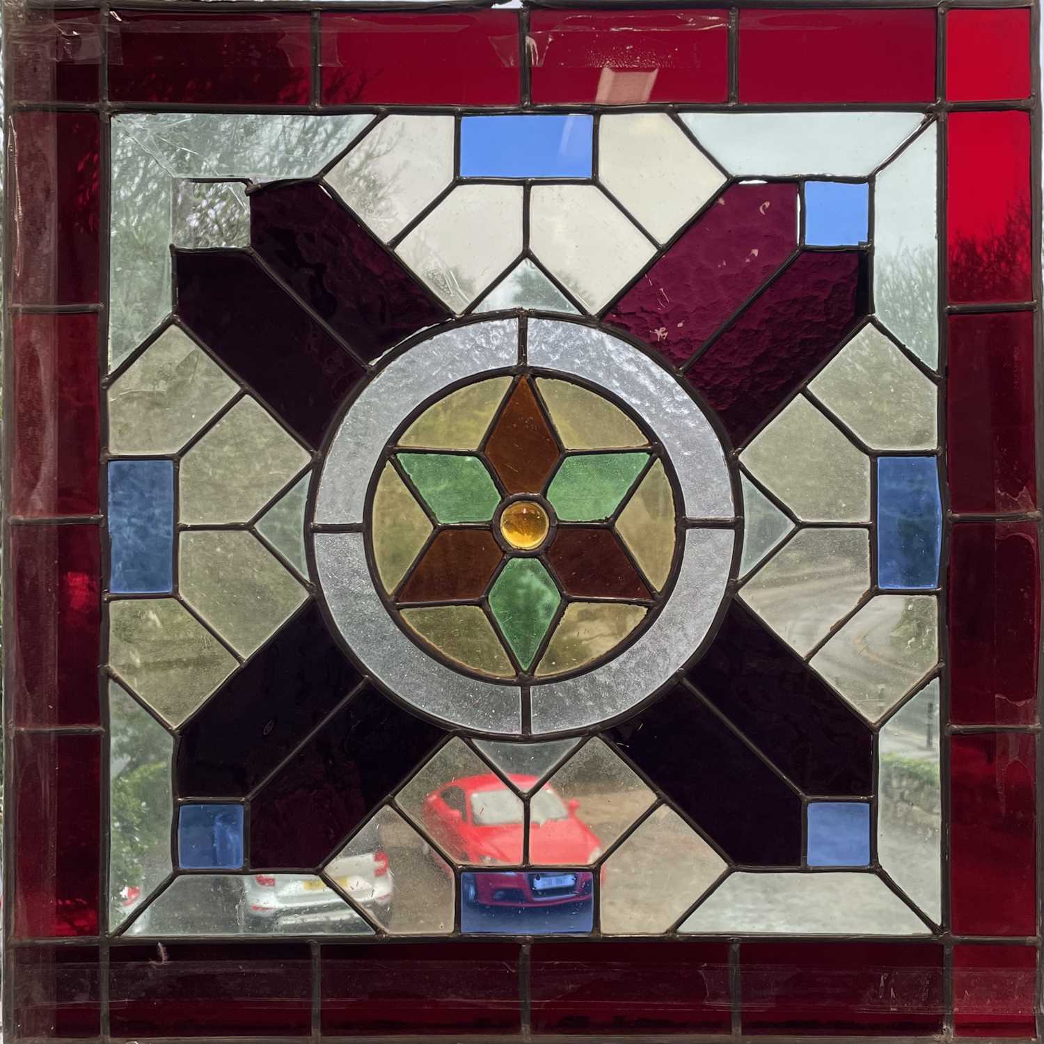 Lot 51 - A square stained glass panel with a