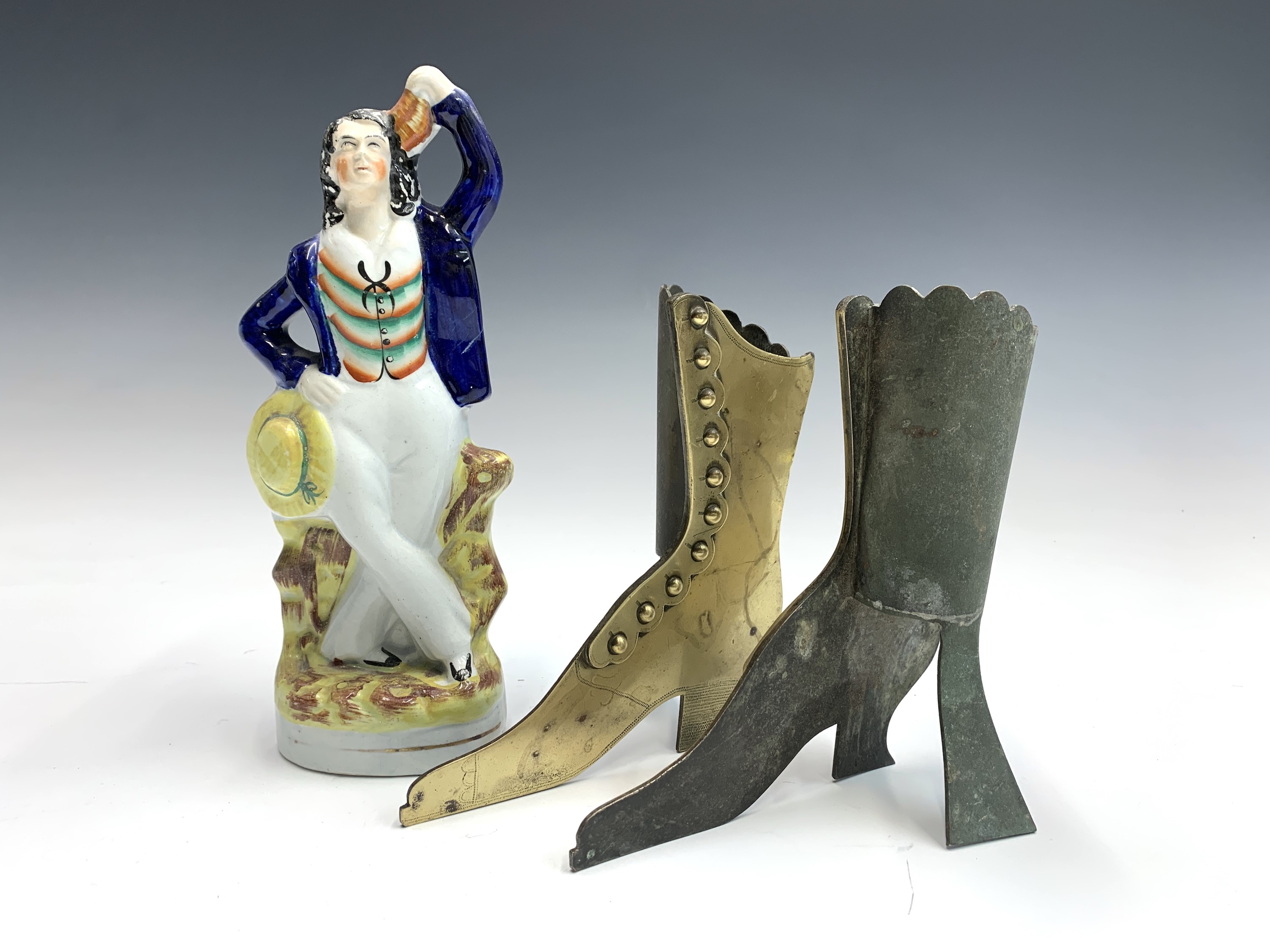 Lot 255 - A pair of Victorian brass buttoned boot