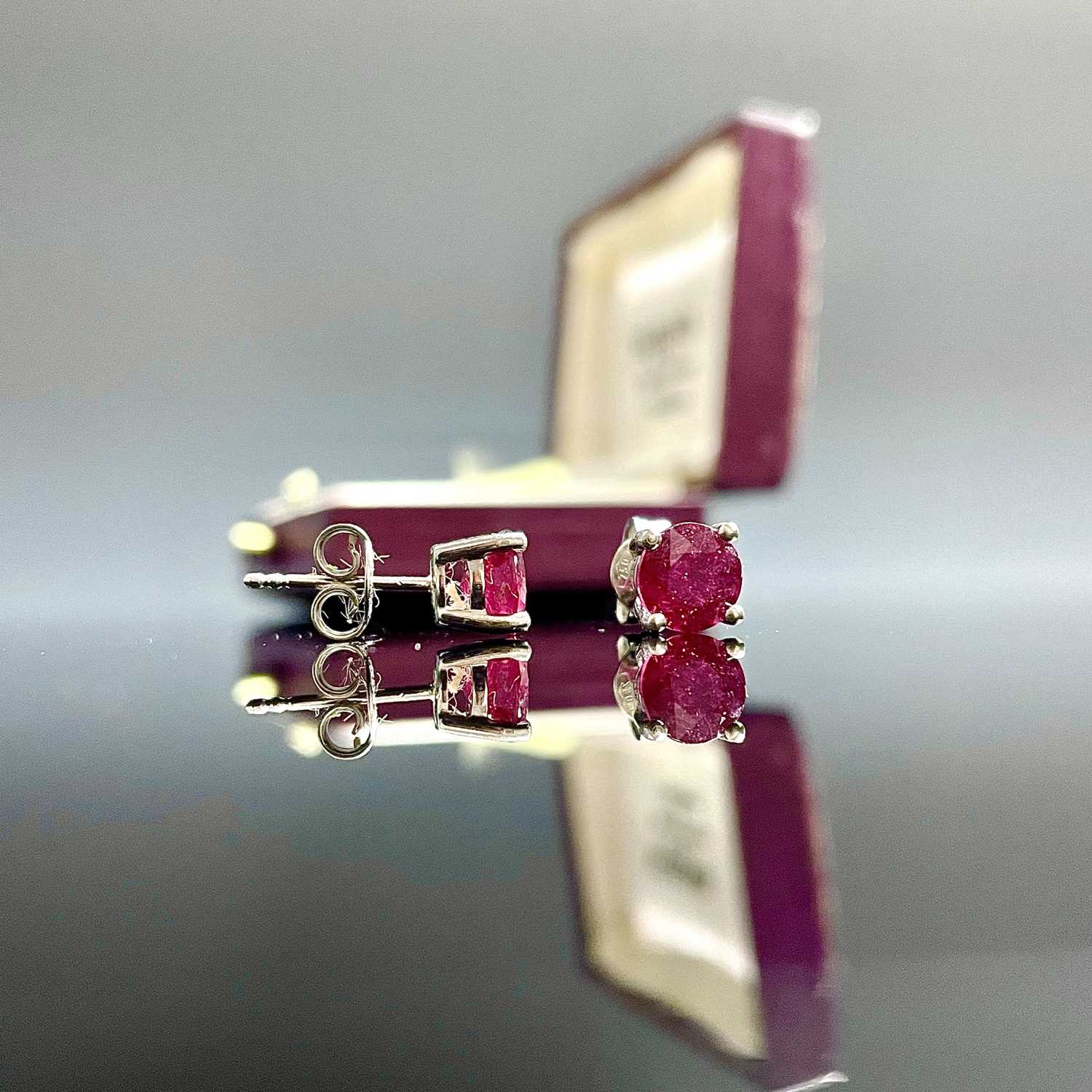 Lot 823 - A pair of modern 18ct white gold ruby set