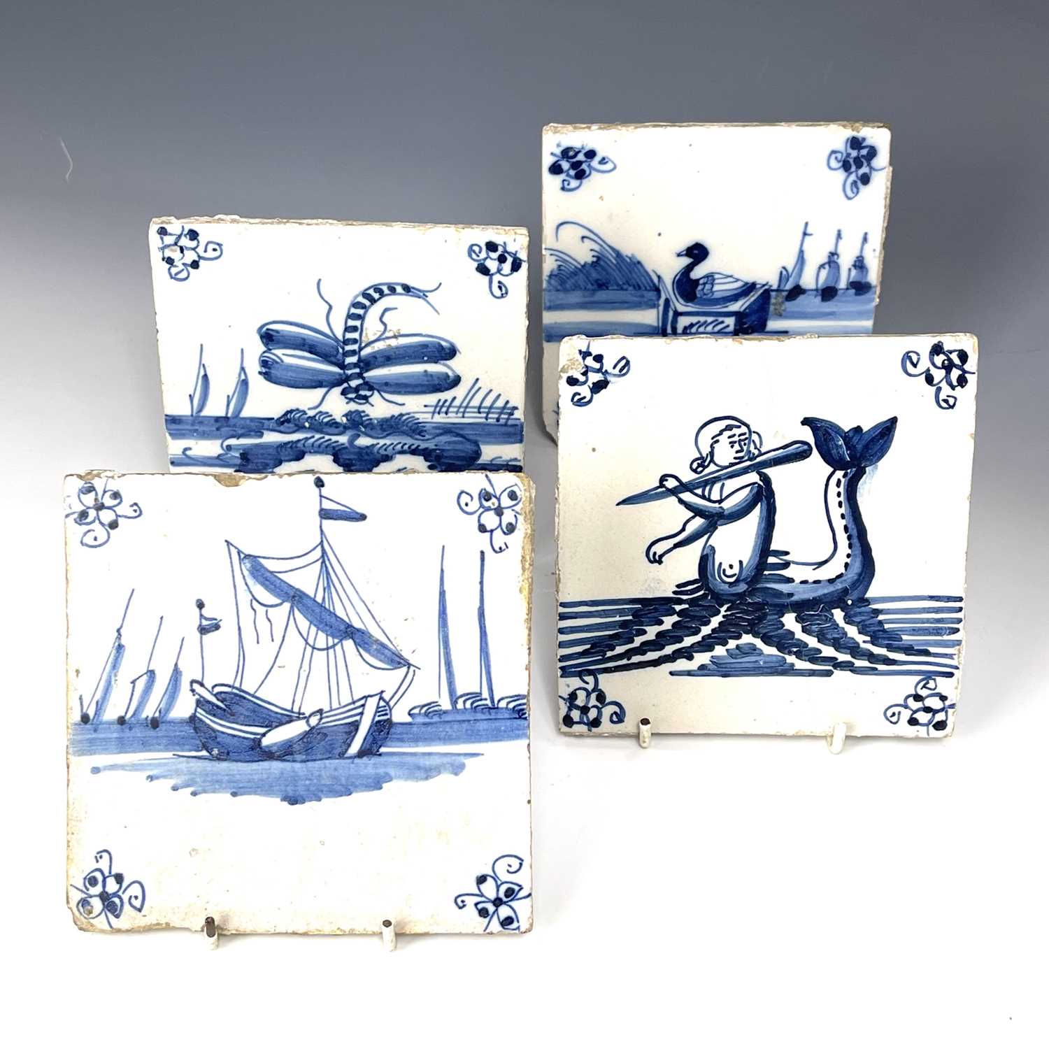 Lot 830 - Four blue and white Dutch Delft tiles,