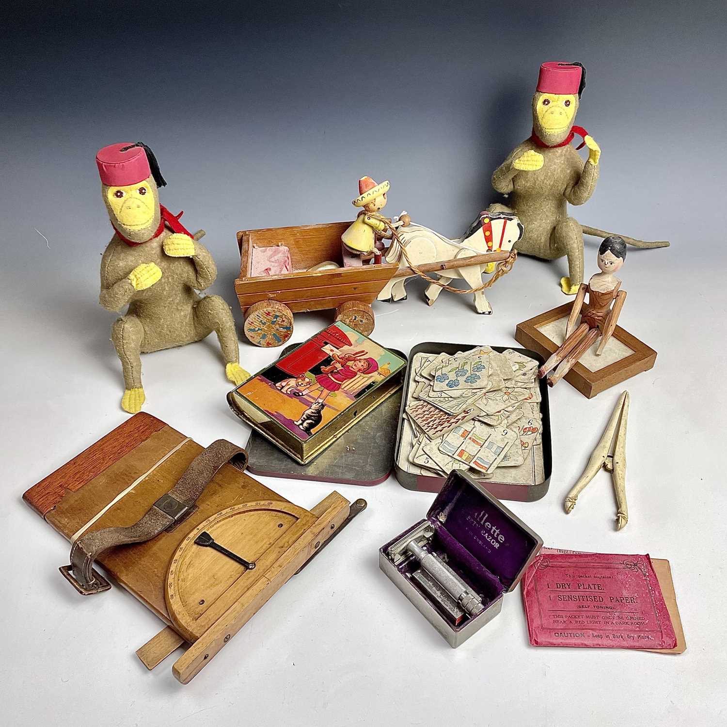 Lot 617 - Fez wearing Monkeys, Wooden Toys and