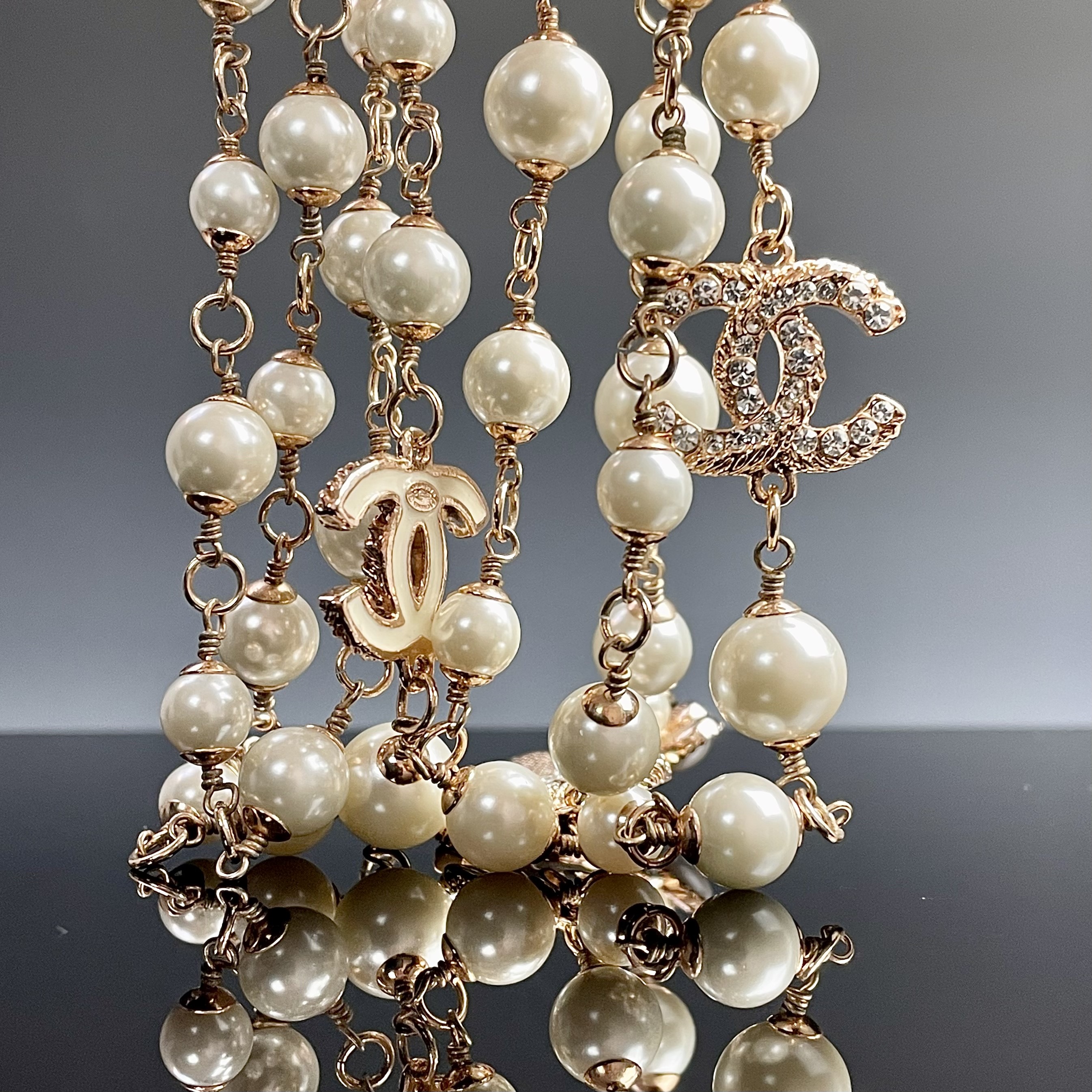 Lot 1053 - A Chanel rose gold plated, white enamel and