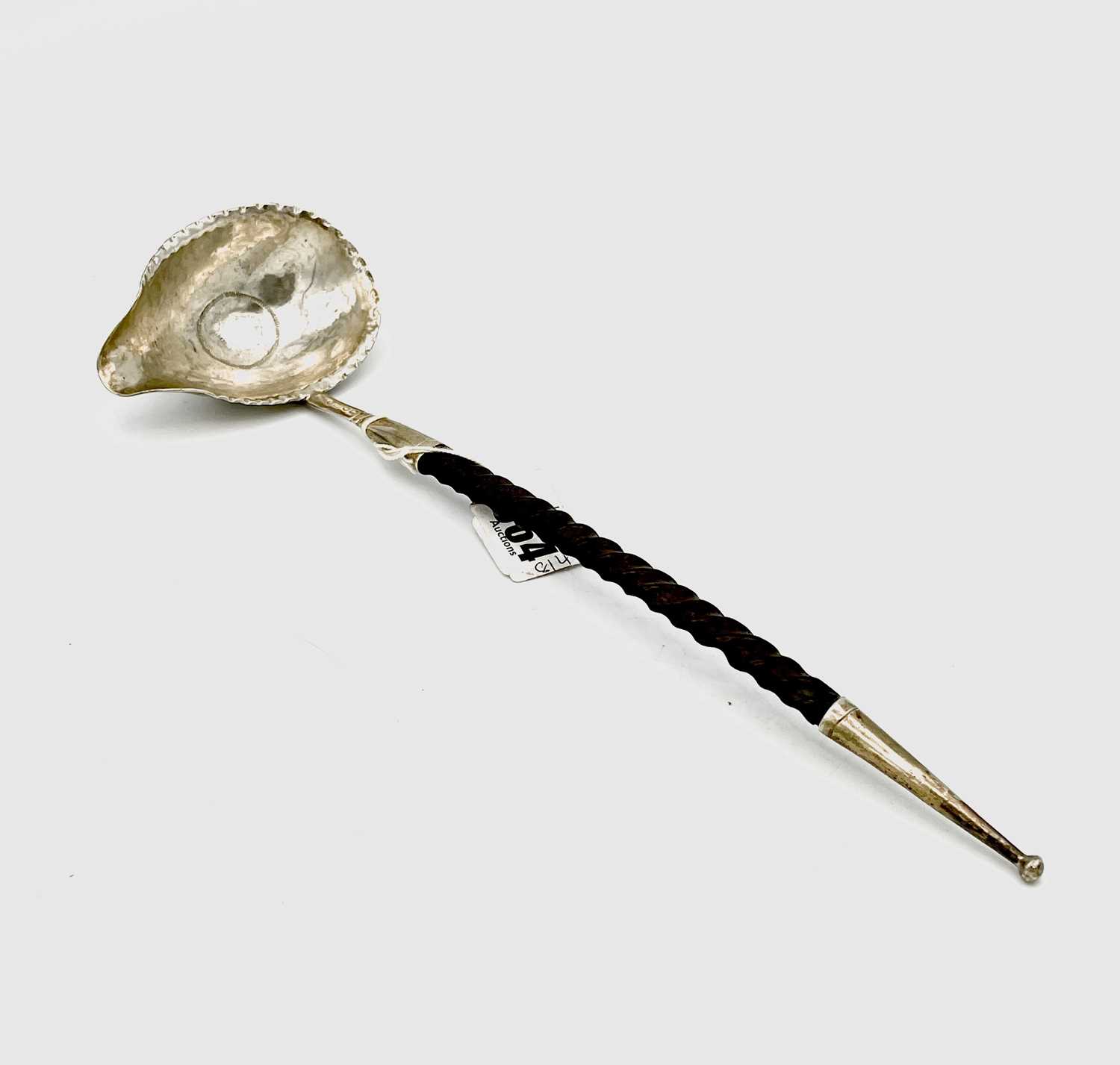 Lot 133 - A Victorian silver toddy ladle with twisted