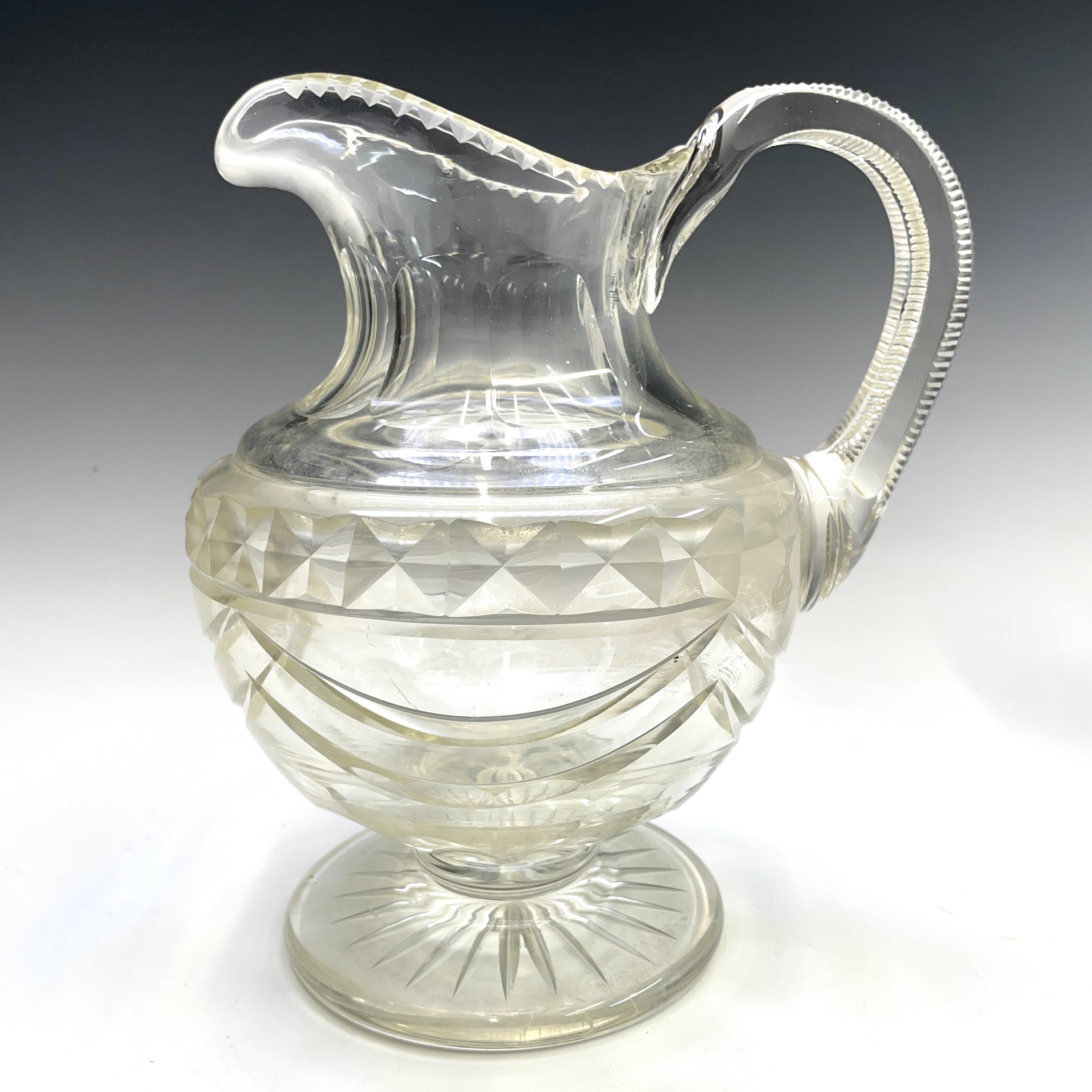 Lot 943 - A Georgian cut glass jug, with stepped and