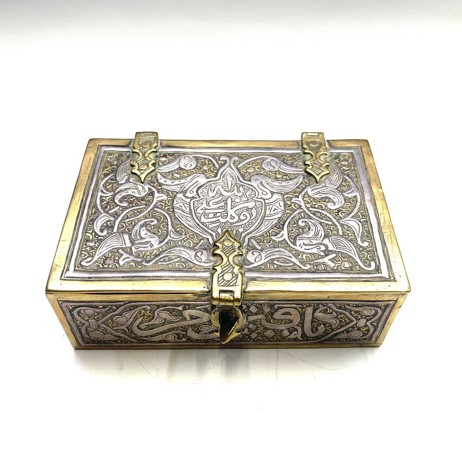 Lot 1040 - A Cairoware brass and silver inlaid box,