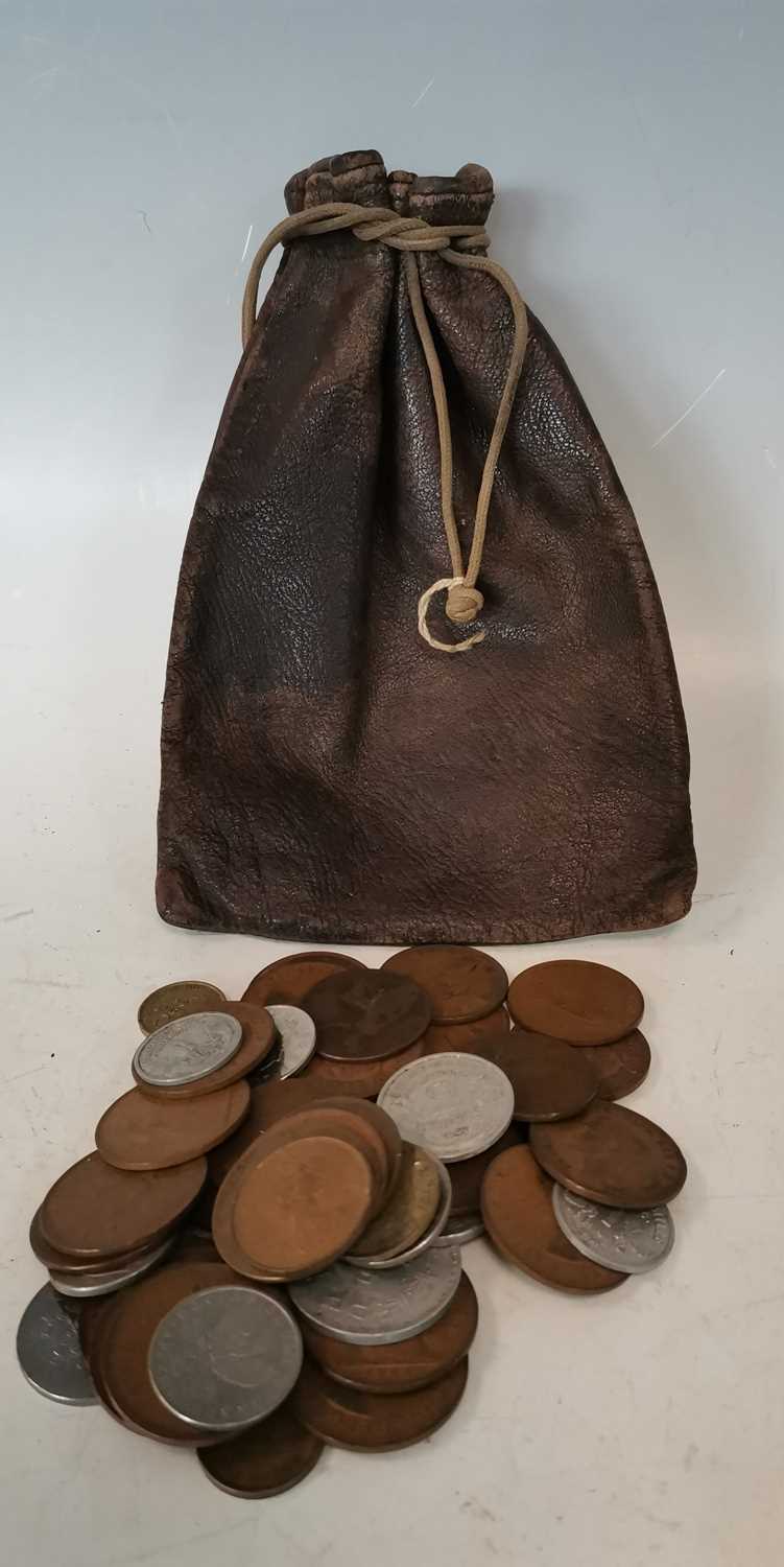 Lot 15 - An antique leather money pouch with