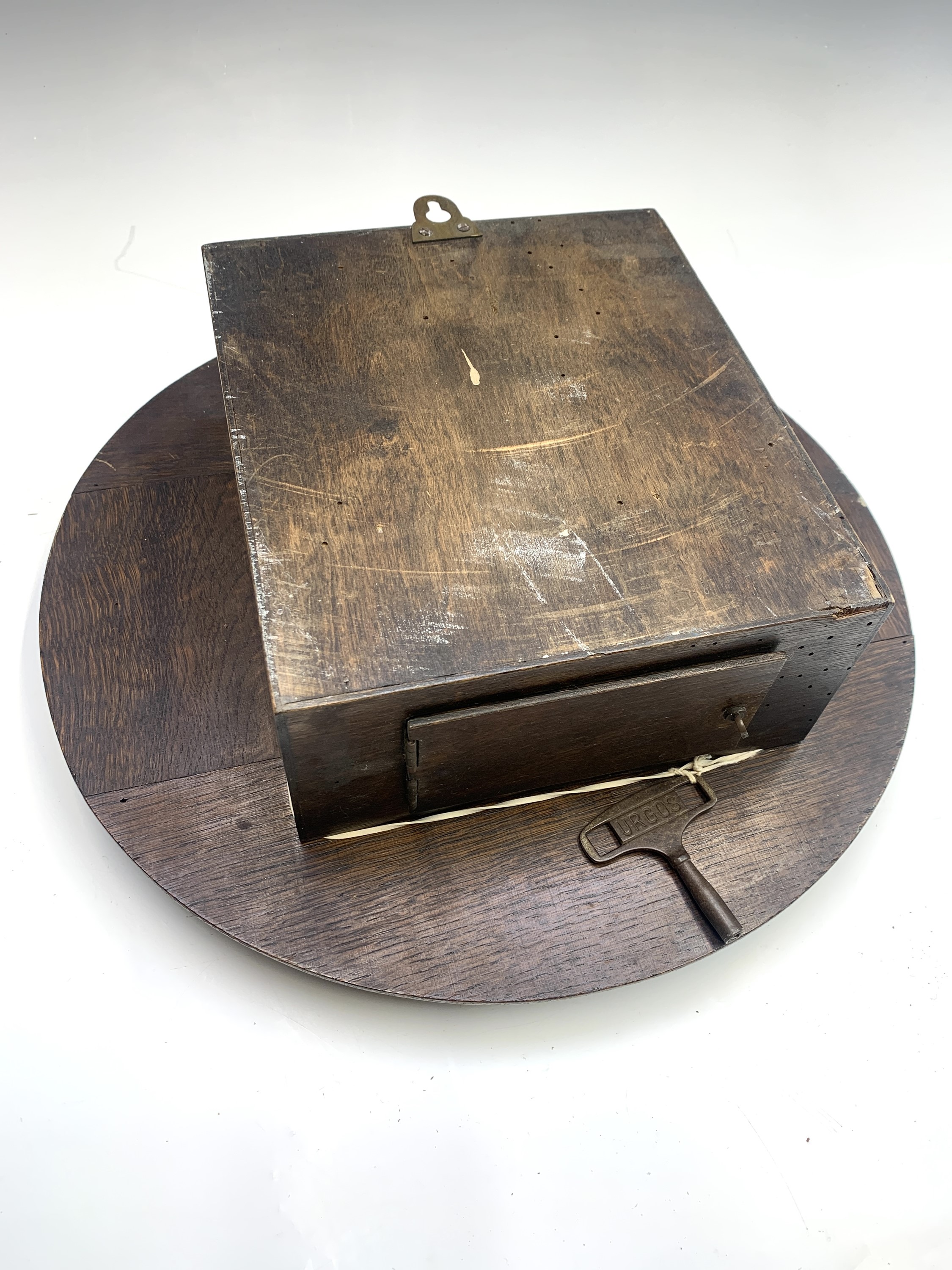 Lot 41 - An English Bentima circular oak cased wall
